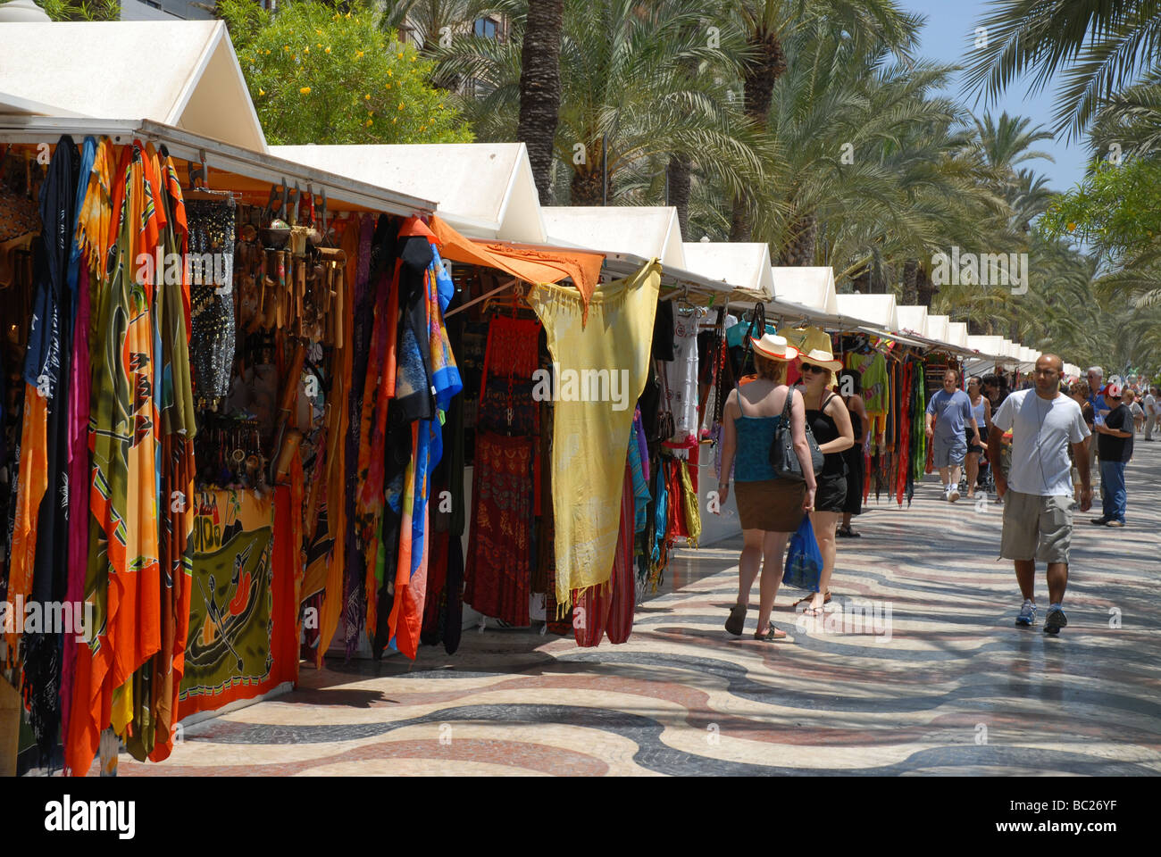 women shopping at street market souvenir stalls, Paseo de la Explanada ...
