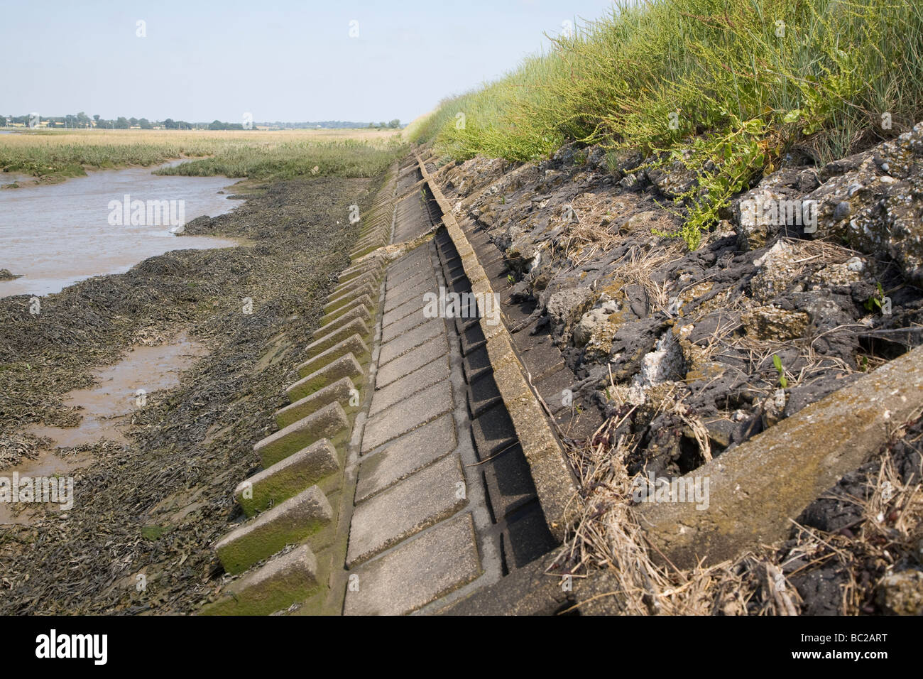 River Deben flood wall defences and dyke Suffolk England Stock Photo ...