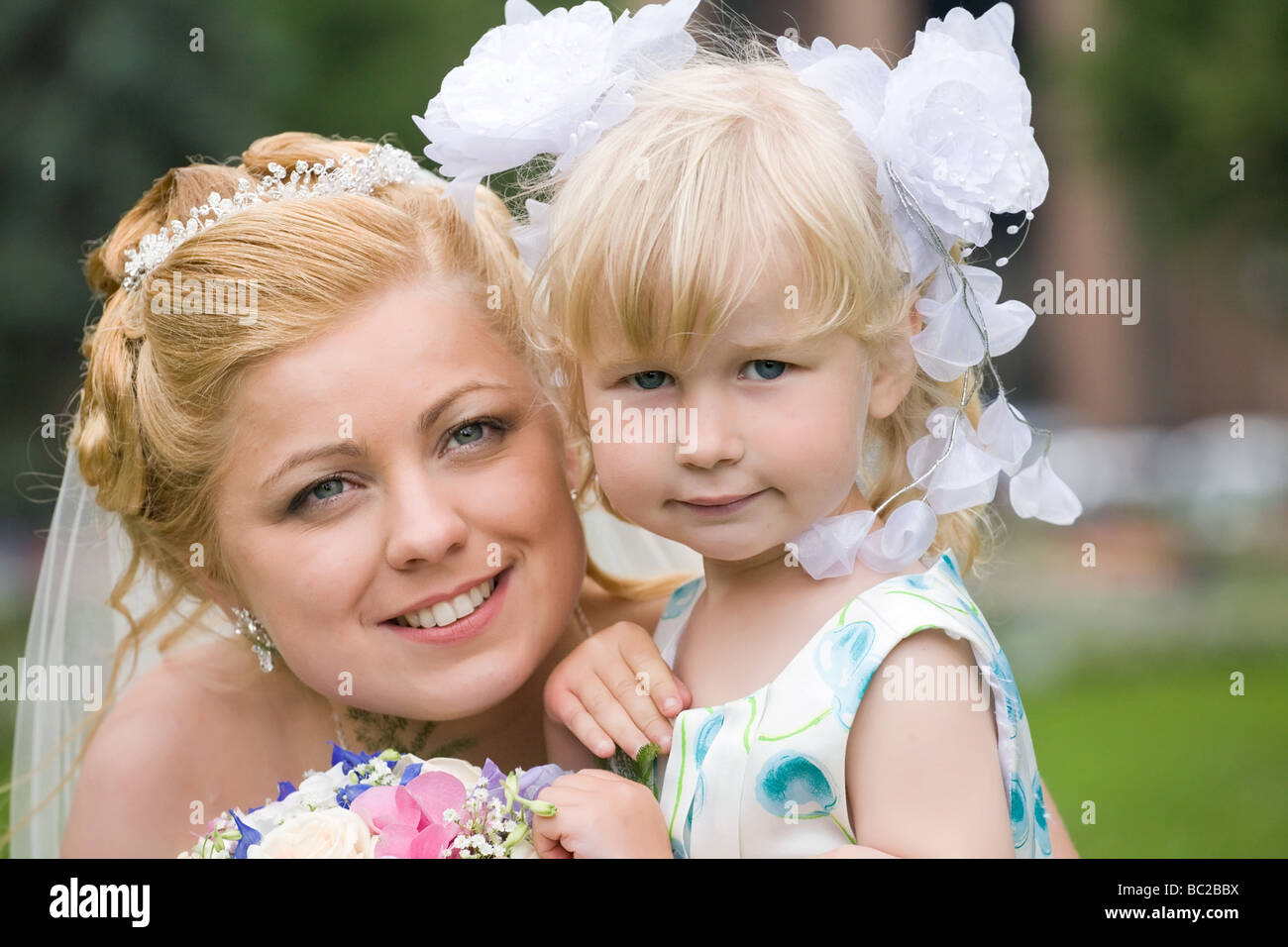 portrait of beautiful bride with little girl Stock Photo - Alamy