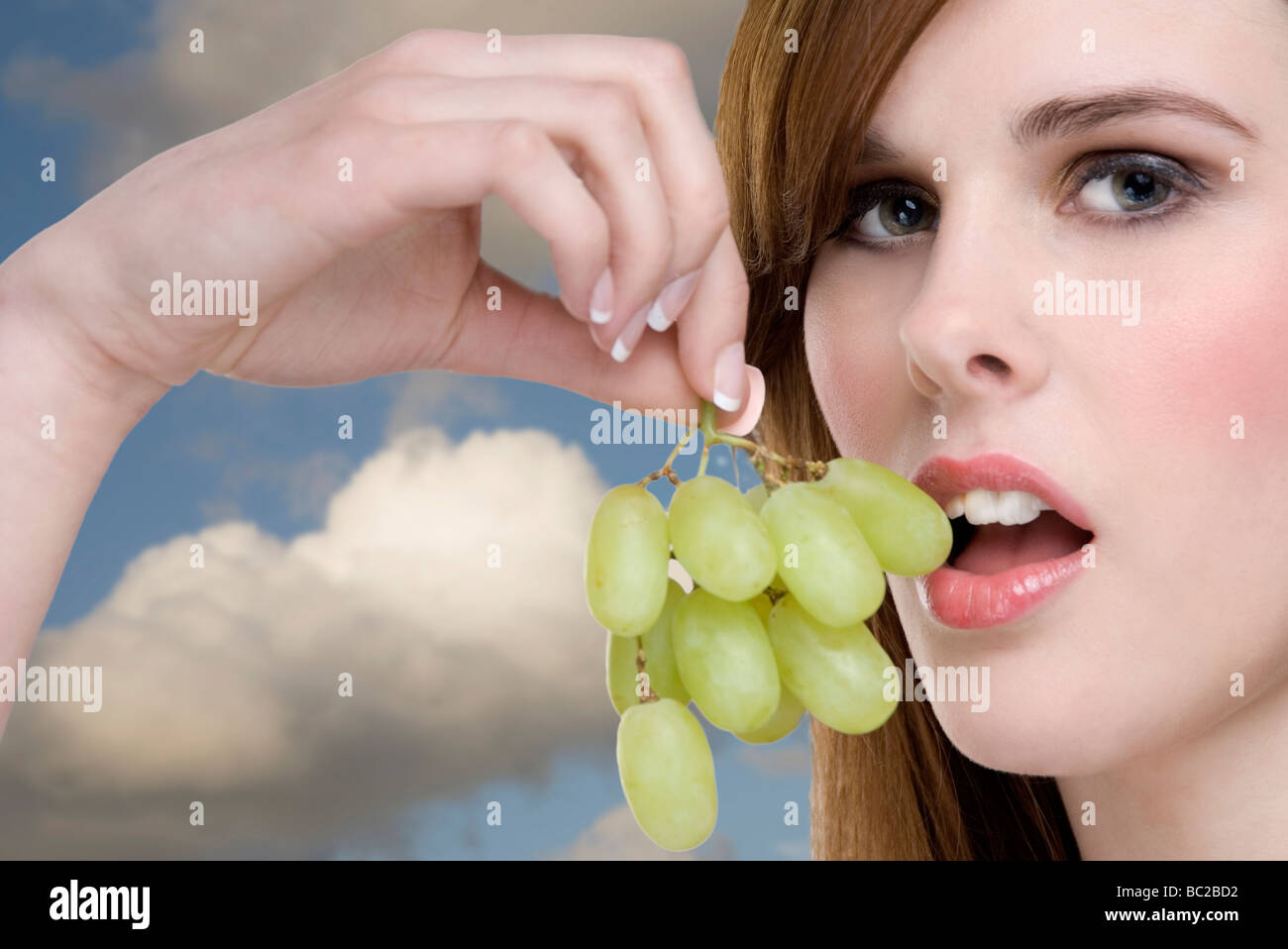 woman eating grapes Stock Photo - Alamy