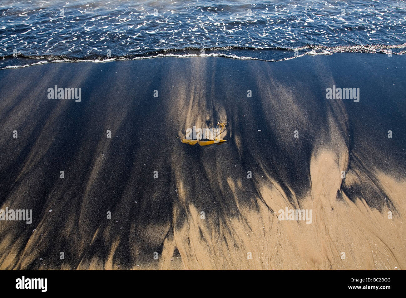 Coal dust on the beach at Newbiggin-by-the-Sea in Northumberland Stock ...