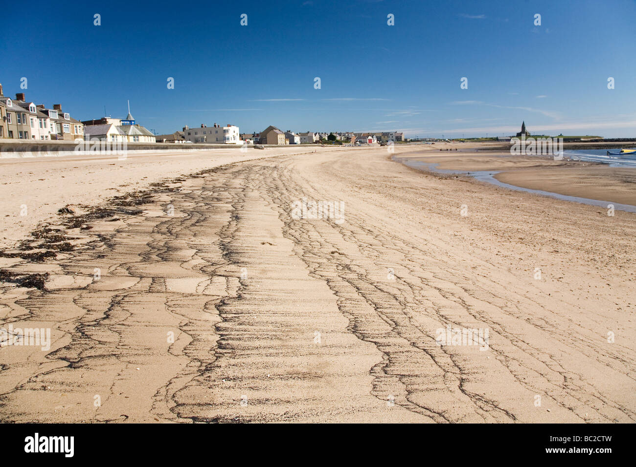Coal dust on the beach at Newbiggin-by-the-Sea Northumberland Stock ...