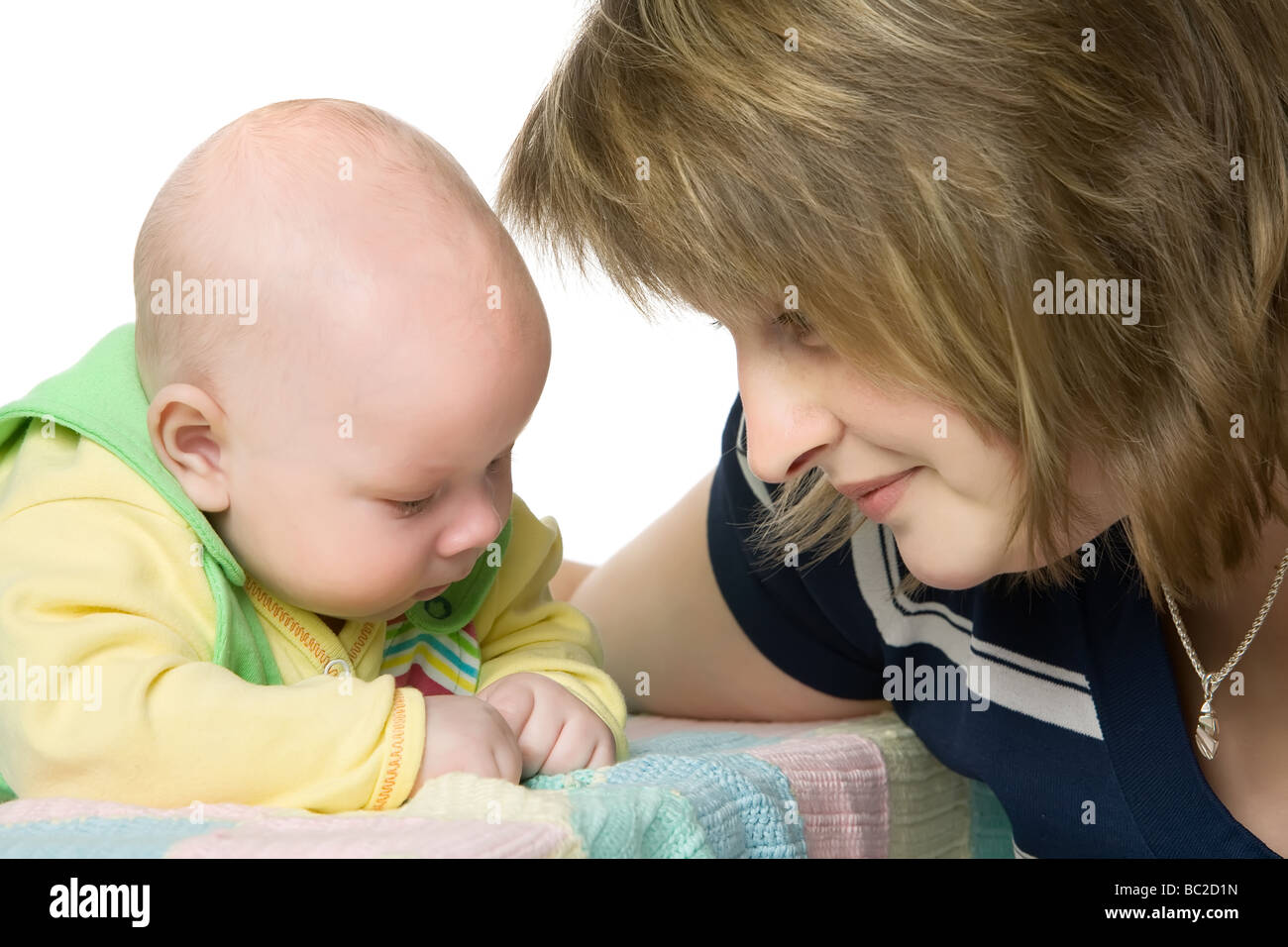 Mum with kid face to face mum smiles isolated on white Stock Photo - Alamy