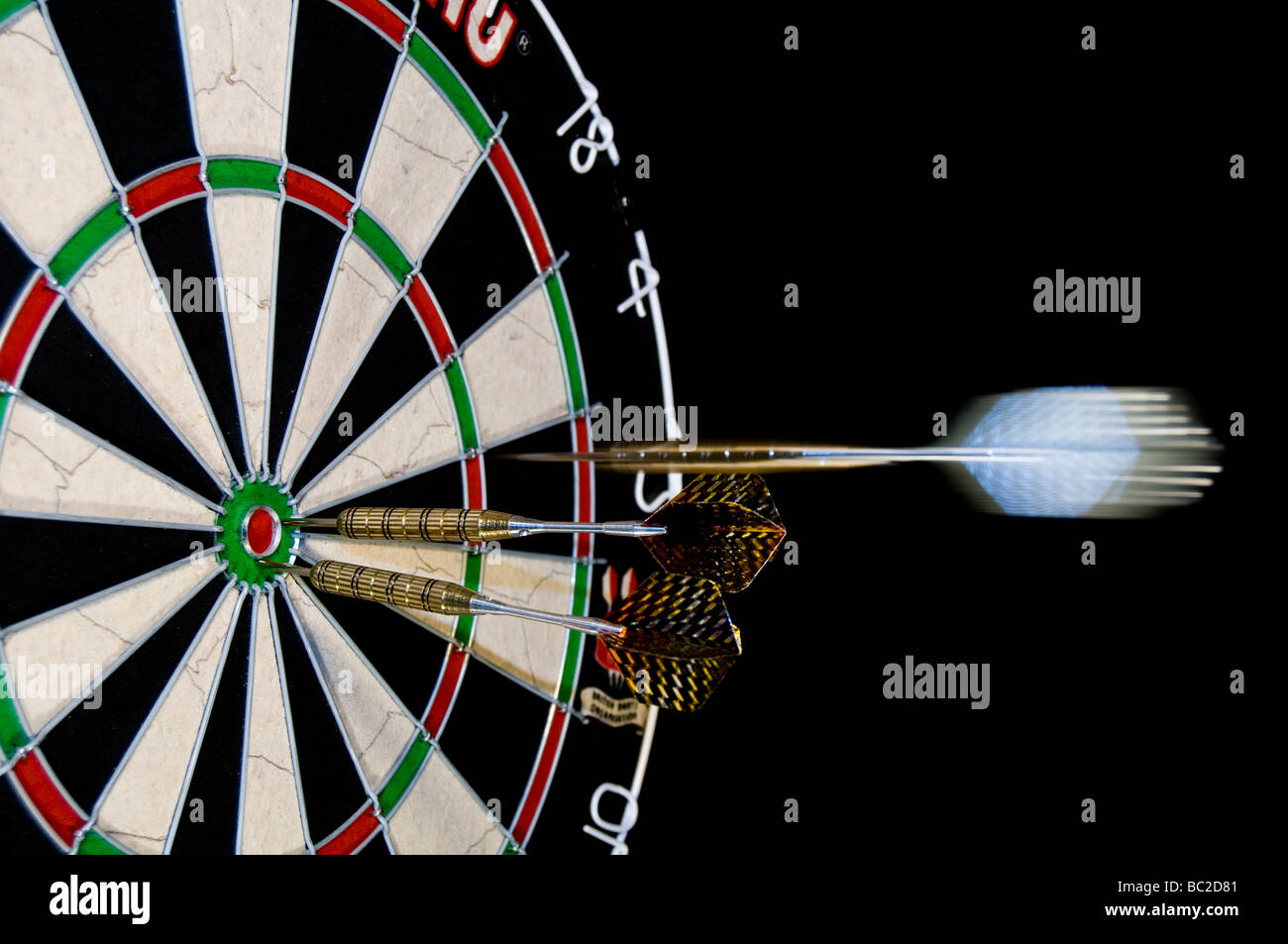 A dart caught in flight Stock Photo - Alamy