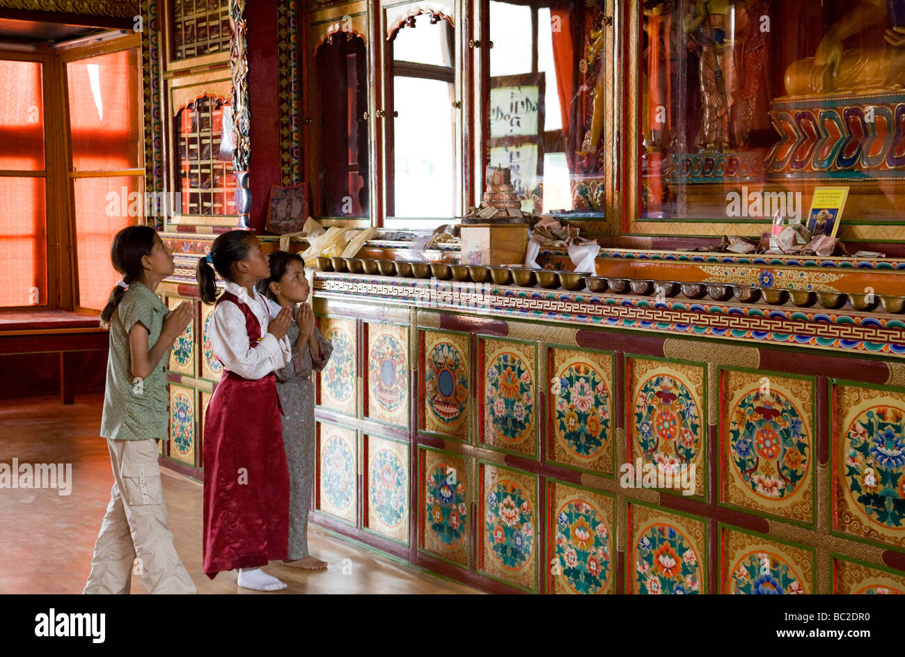 Tibetan children praying at Jivatsal temple. Choglamsar. Near Leh ...