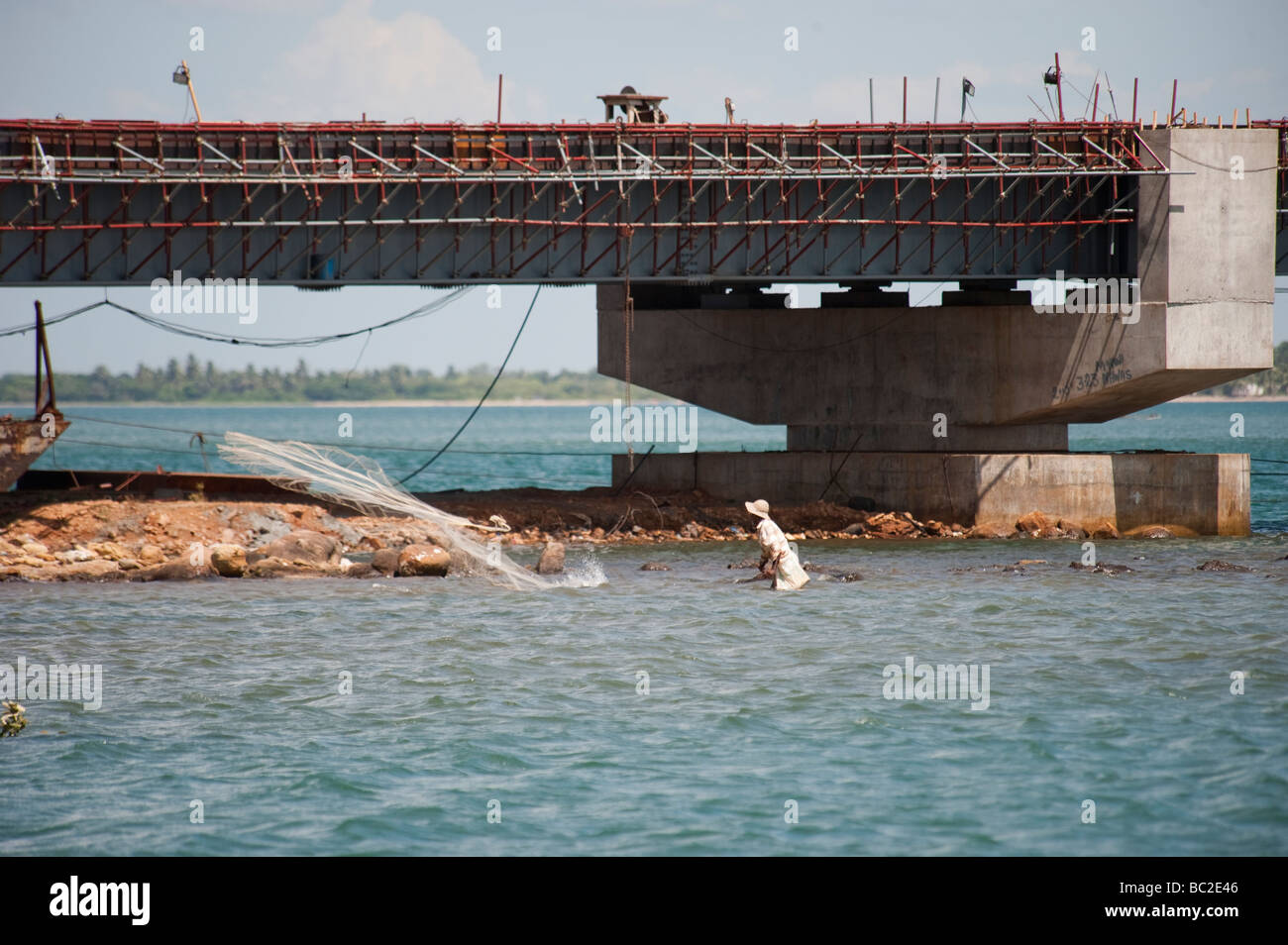 Man Net Fishing under Mutur Kinniya new bridge under construction ...