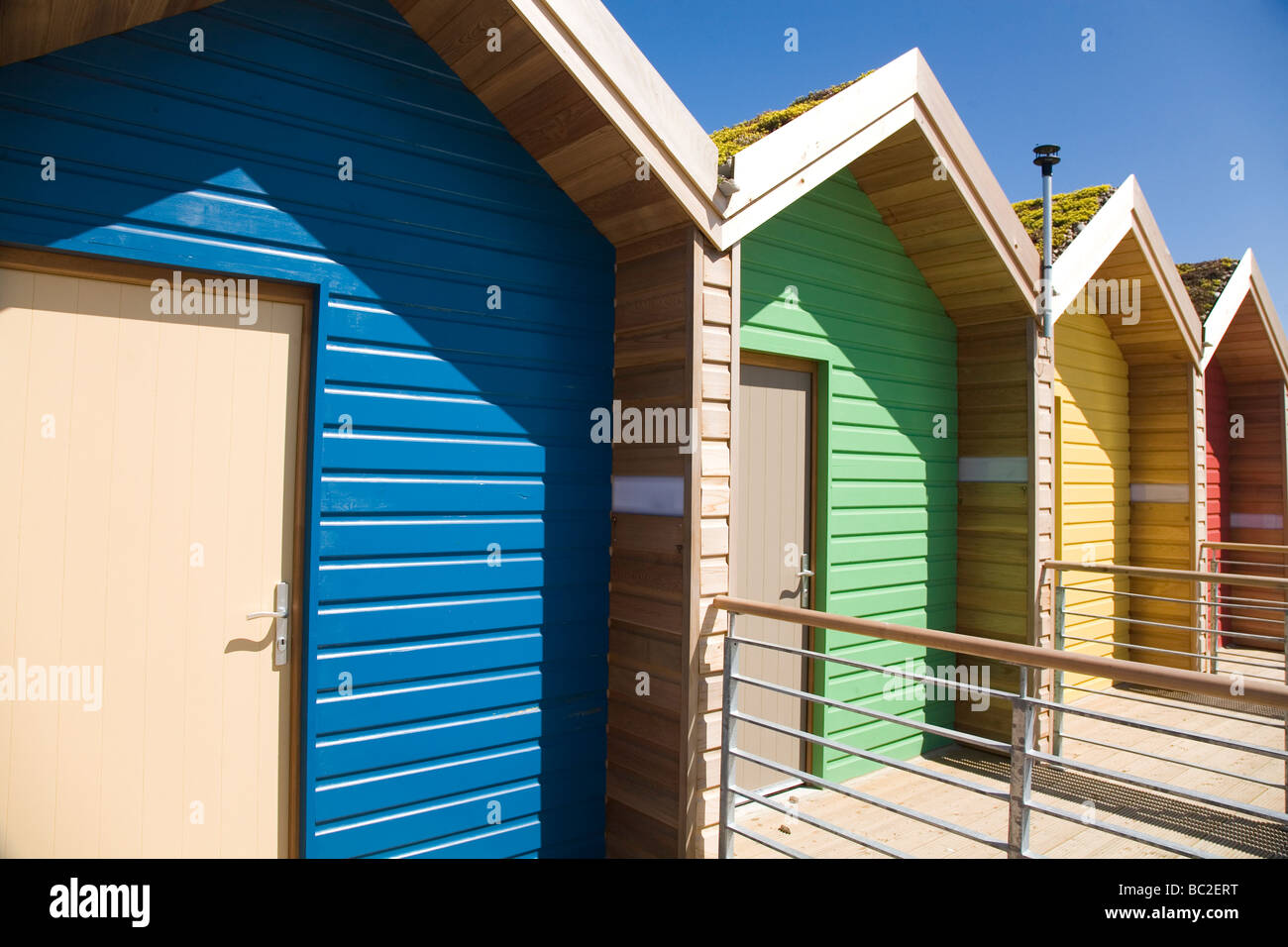 Colouful modern beach huts at Blyth in northern England. The huts can ...