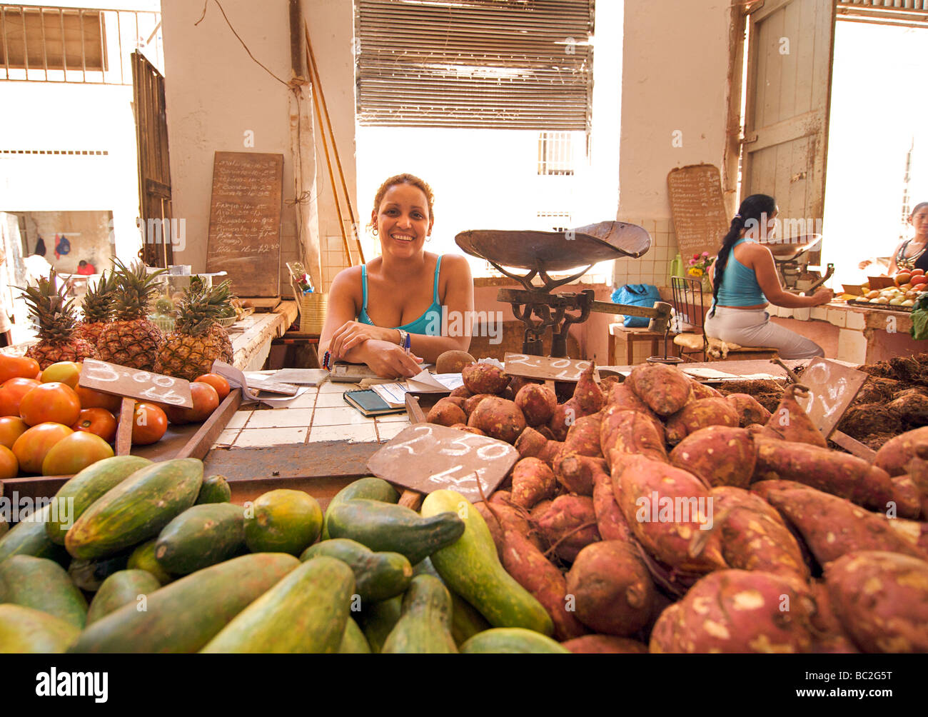 Cuban fruit and vegetable sellers at a covered market in Old Havana ...