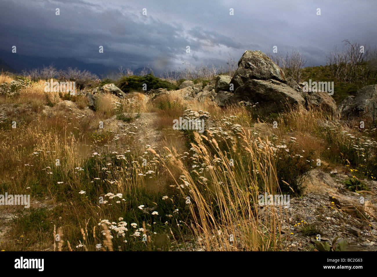 Heavy rain clouds hang over the Remarkables in Queenstown, South Island ...