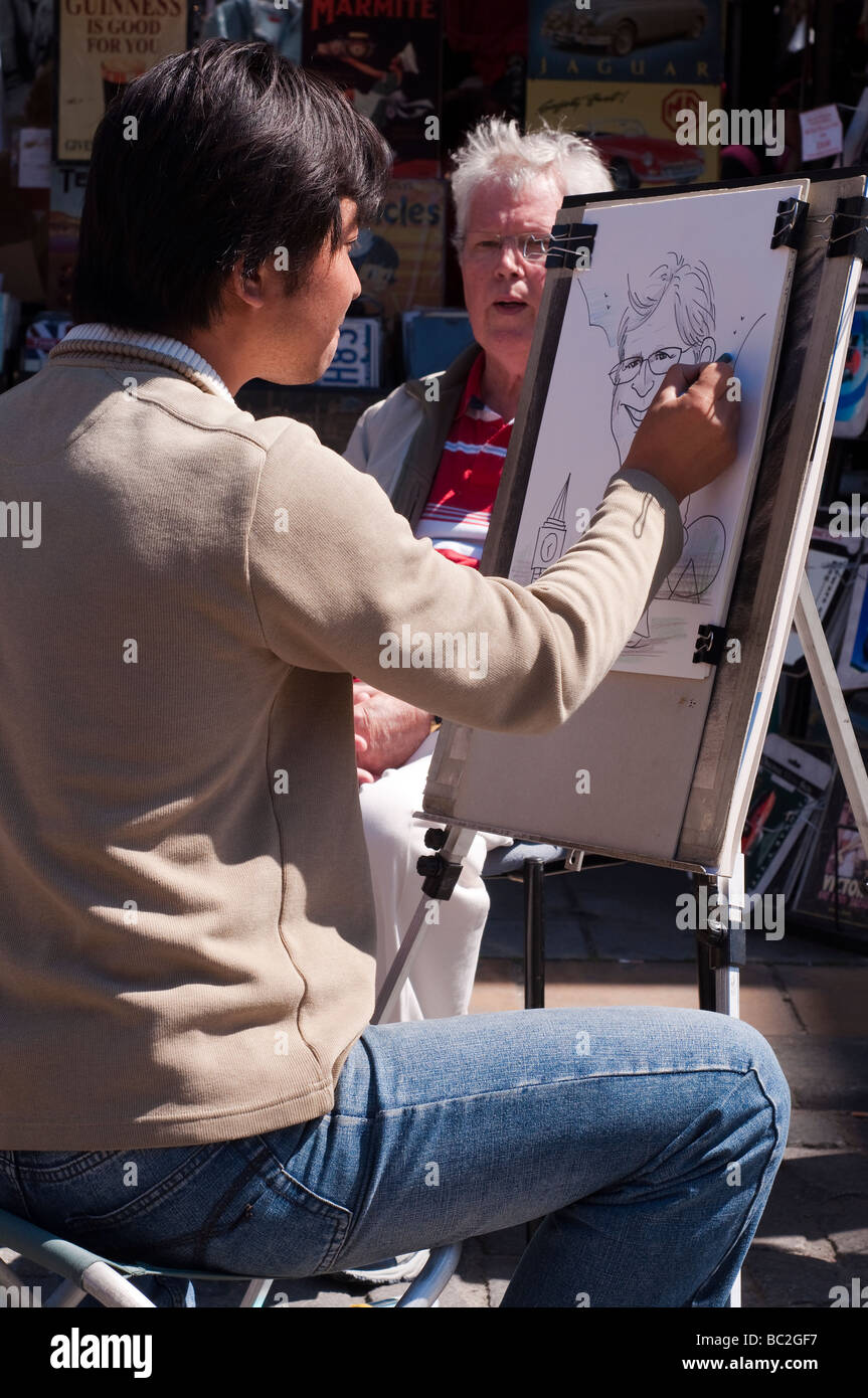 Street artist drawing caricature hi-res stock photography and images ...