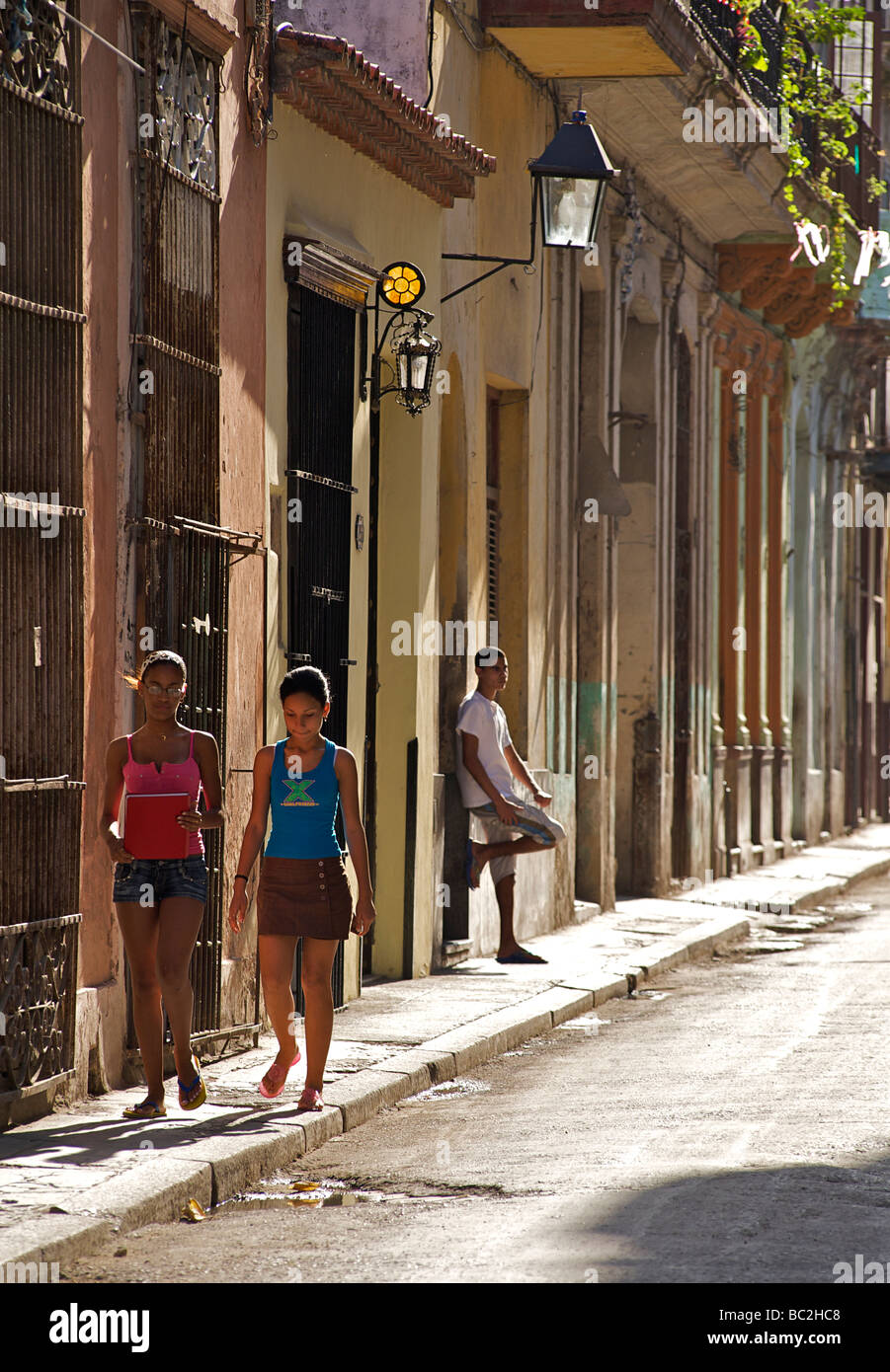 Cuban street scene. Watching the world go by is a popular pastime in ...