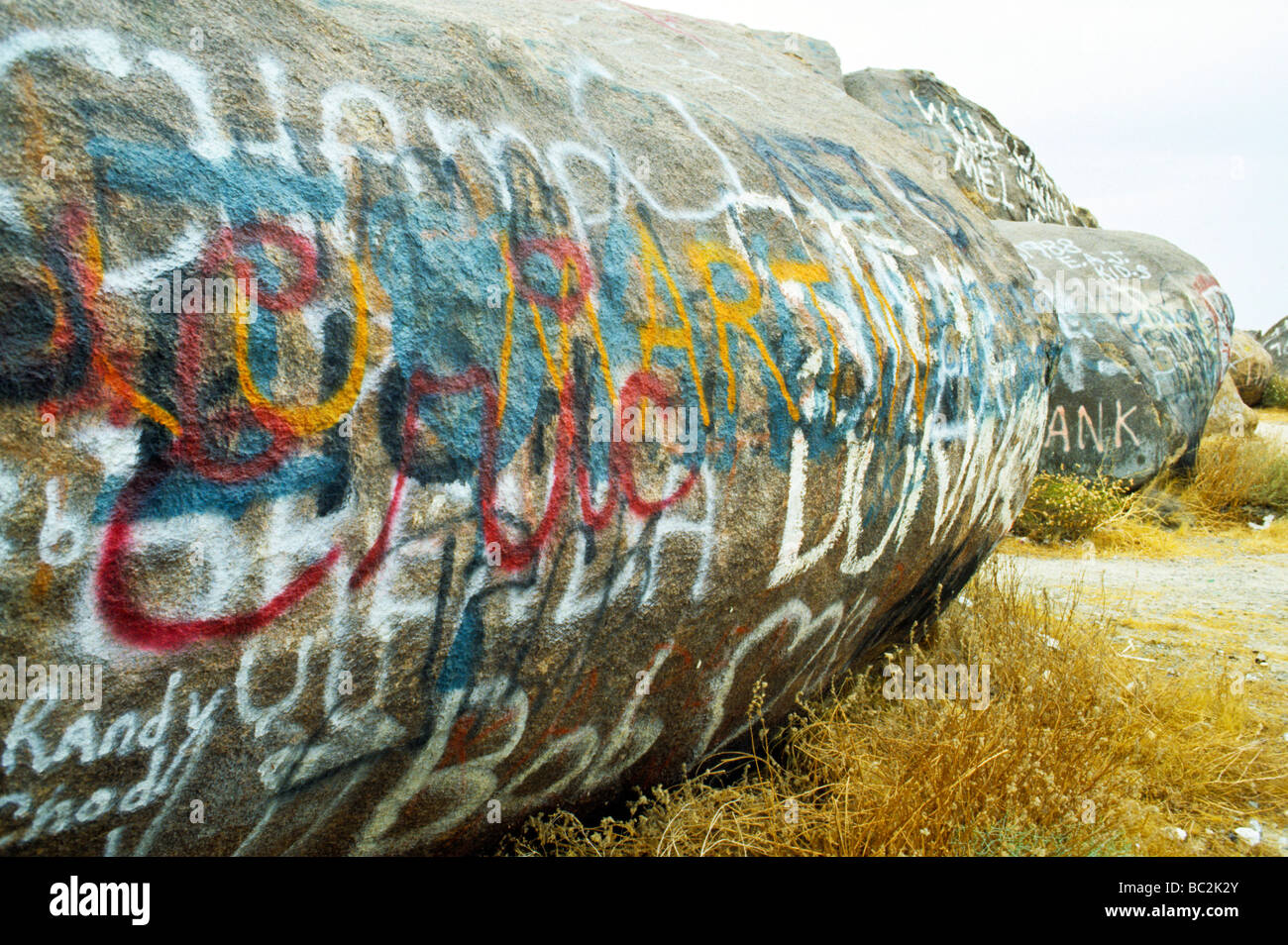 graffiti rock desert vandalism identify name mark deface nature ...