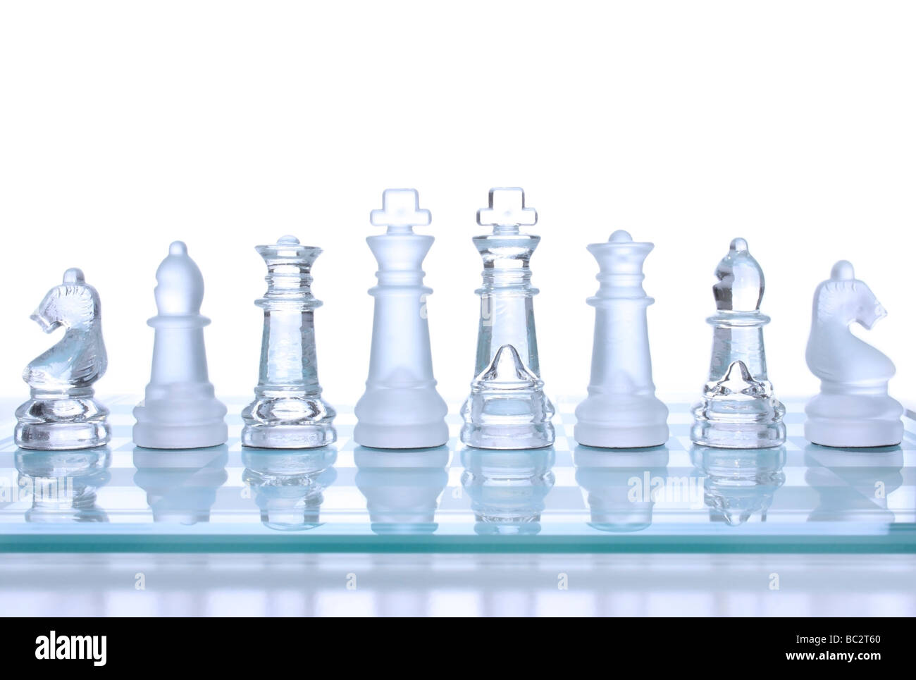 Translucent glass chess figures on a board Stock Photo - Alamy