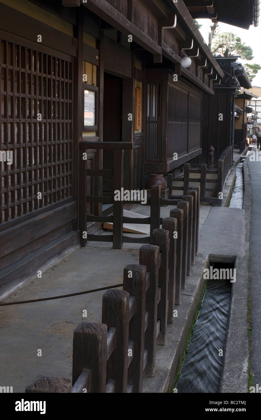 A water channel runs past the Kusakabe Heritage House in Takayama a ...