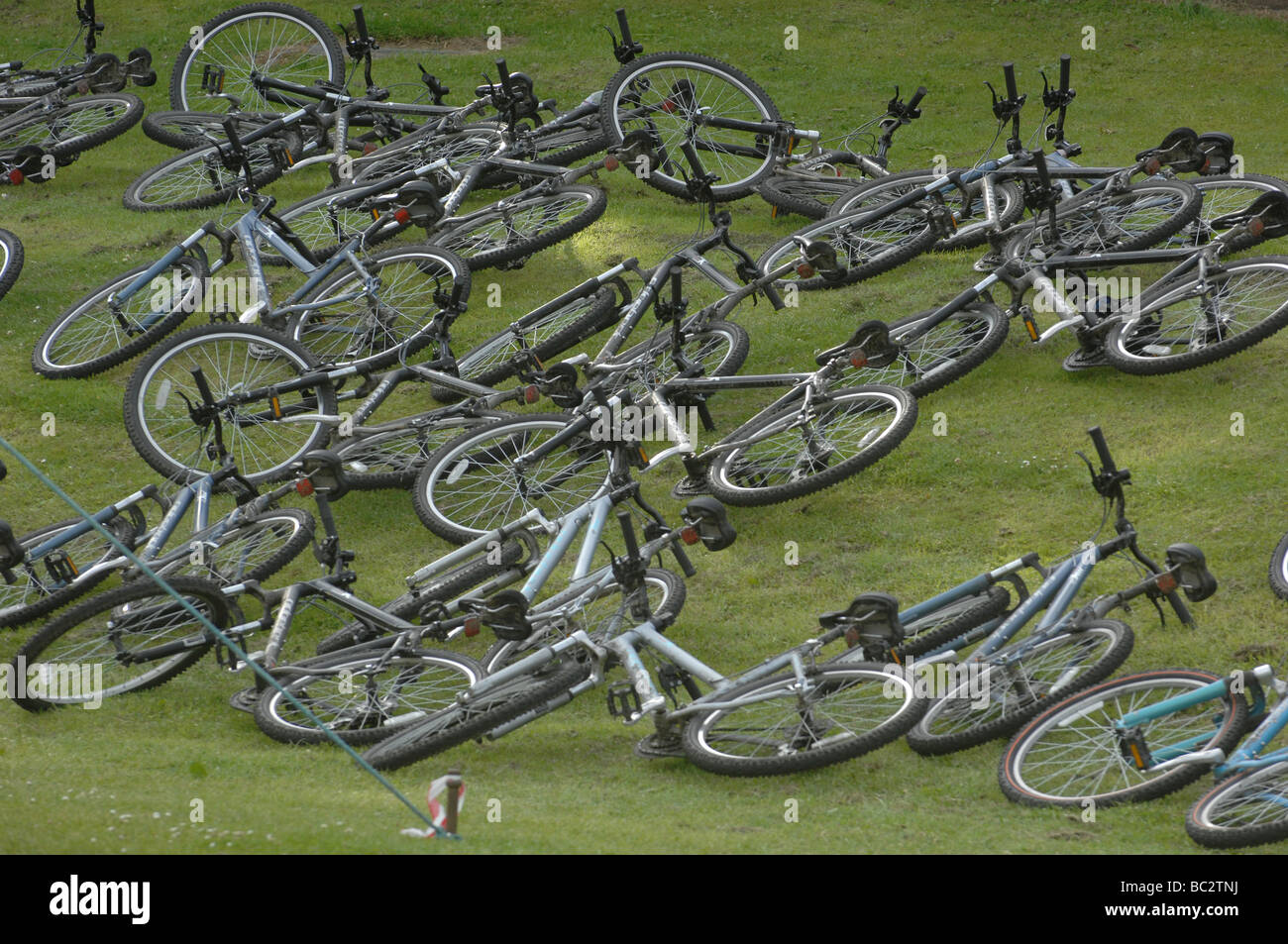 Bicycles laying down on hillside Stock Photo - Alamy