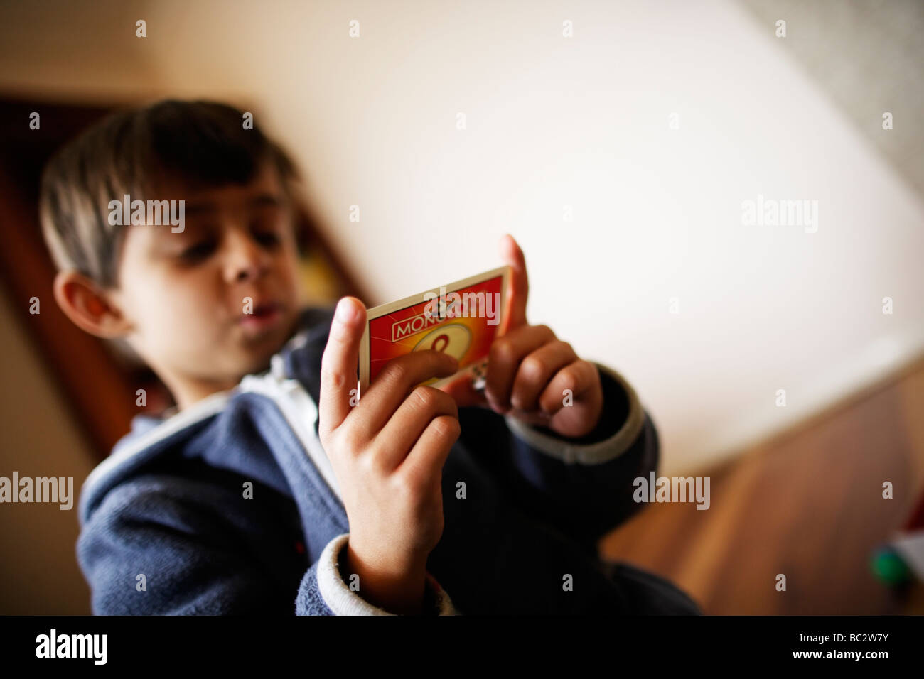 Children play Monopoly Stock Photo - Alamy