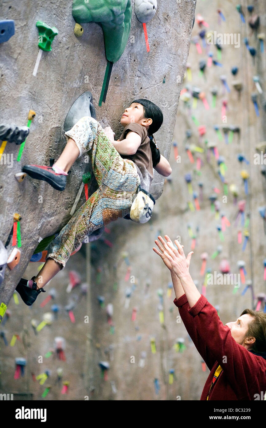 A young climber in an indoor rock climbing gym Stock Photo - Alamy