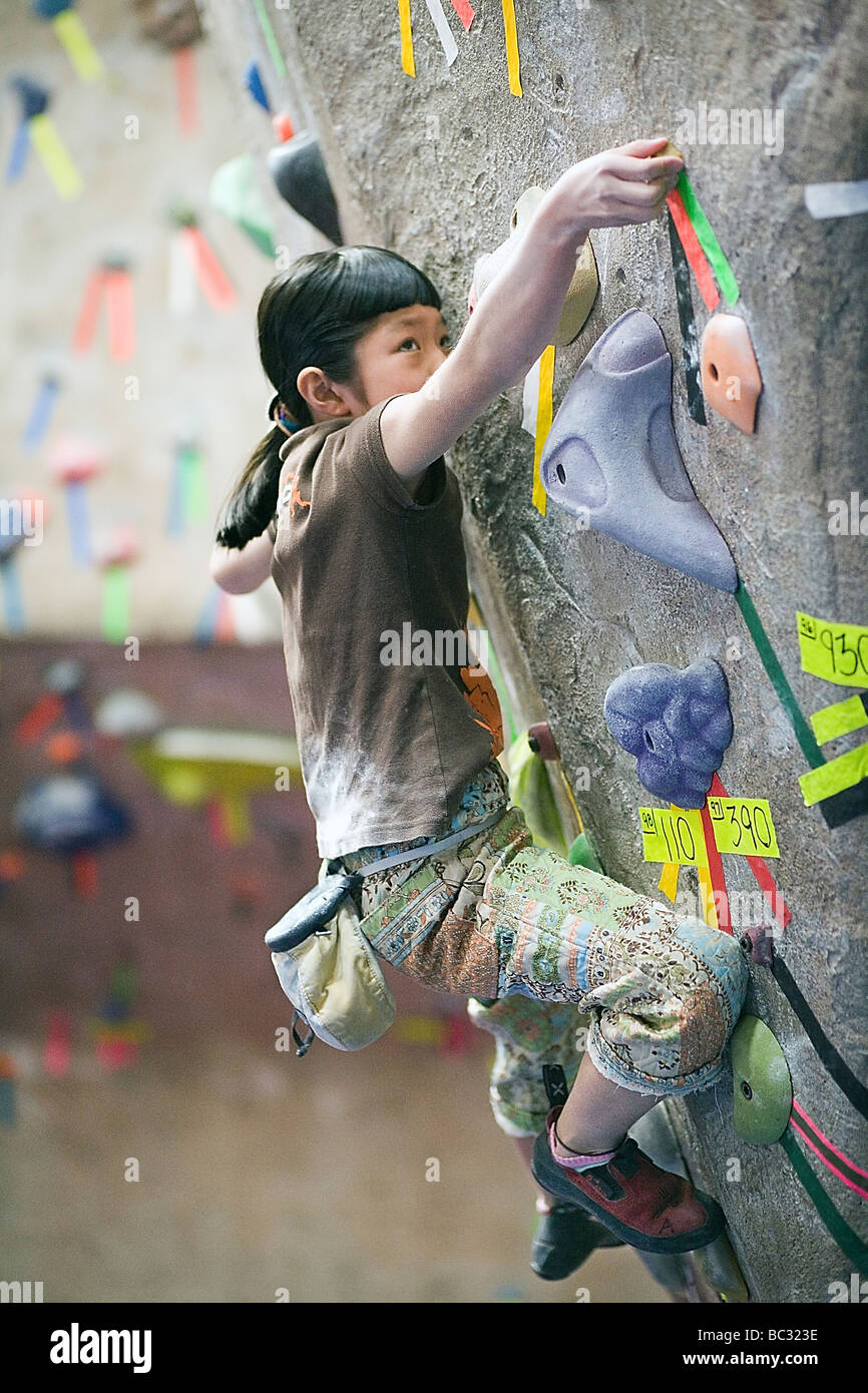 A young climber in an indoor rock climbing gym Stock Photo - Alamy