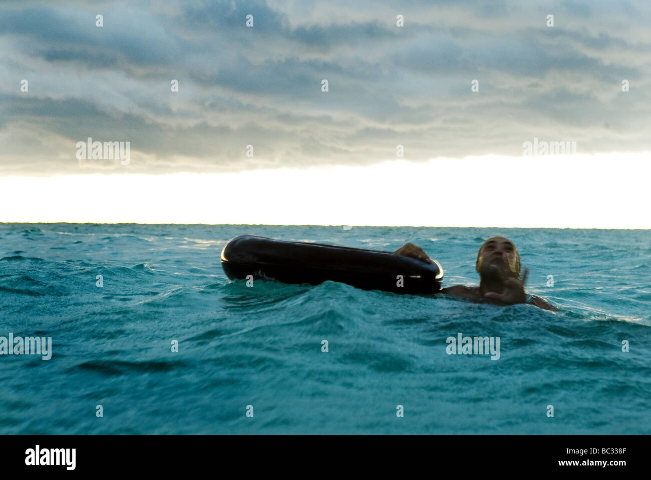 Man floating in an inner tube hi-res stock photography and images - Alamy