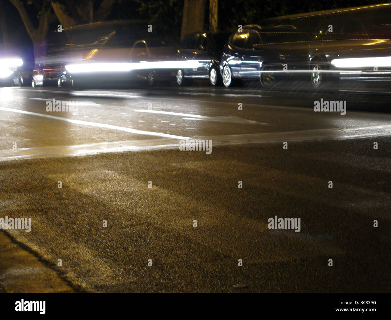 fast cars in dark street at night Stock Photo - Alamy