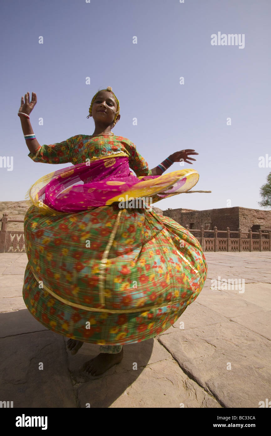 A young Hindu girl dancing in the street in Jodphur, Rajasthan, India ...