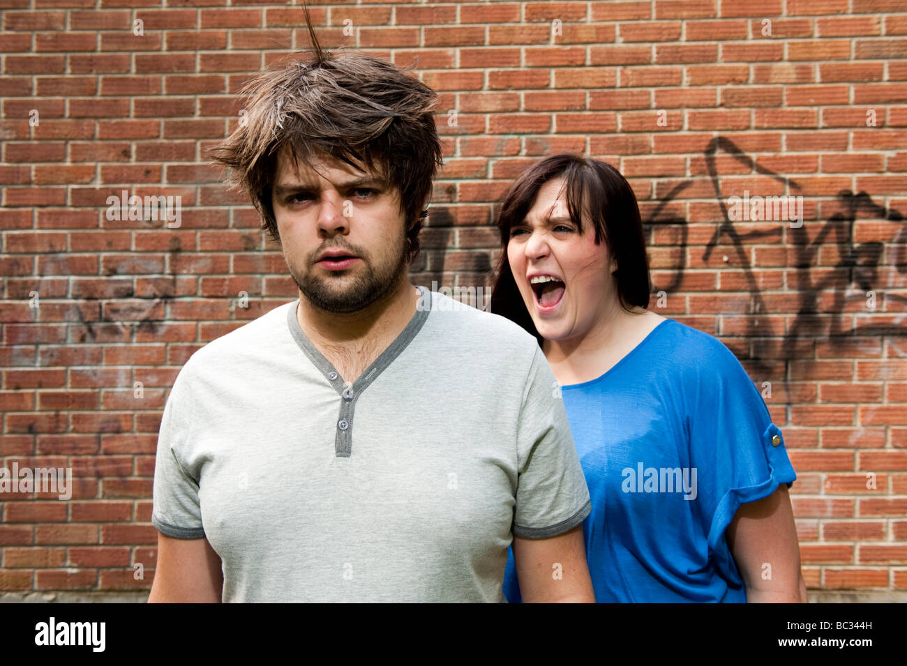 a young couple man woman boy girl arguing shouting relationship ...