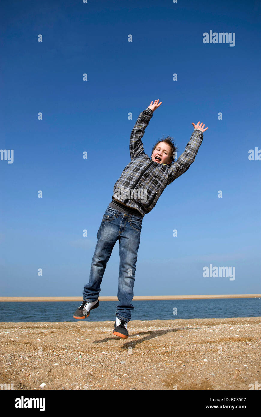 Child jumping into the air Stock Photo - Alamy