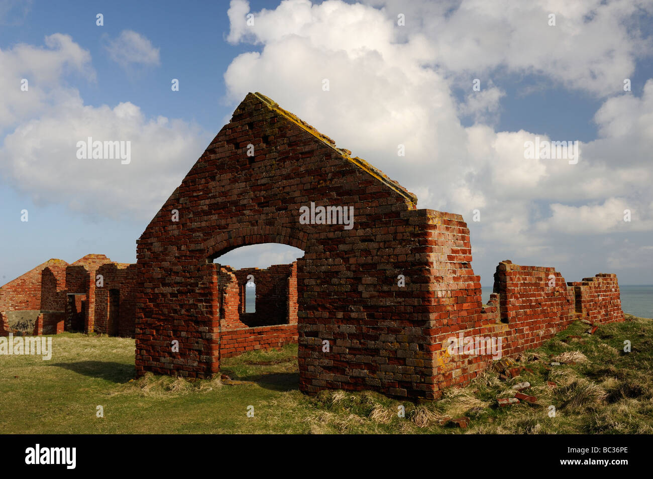 Abandoned brick buildings on the headland at Ynys Barry near Abercastle ...