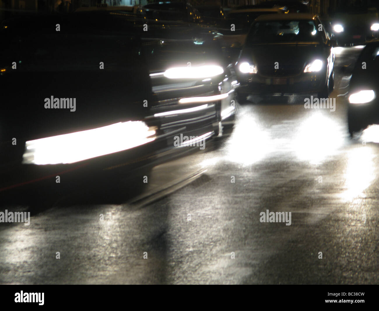 fast cars in dark street at night Stock Photo - Alamy