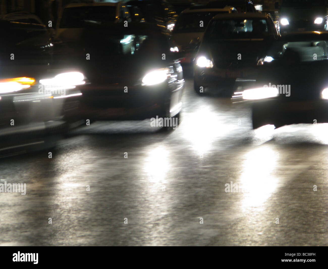 fast cars in dark street at night Stock Photo - Alamy