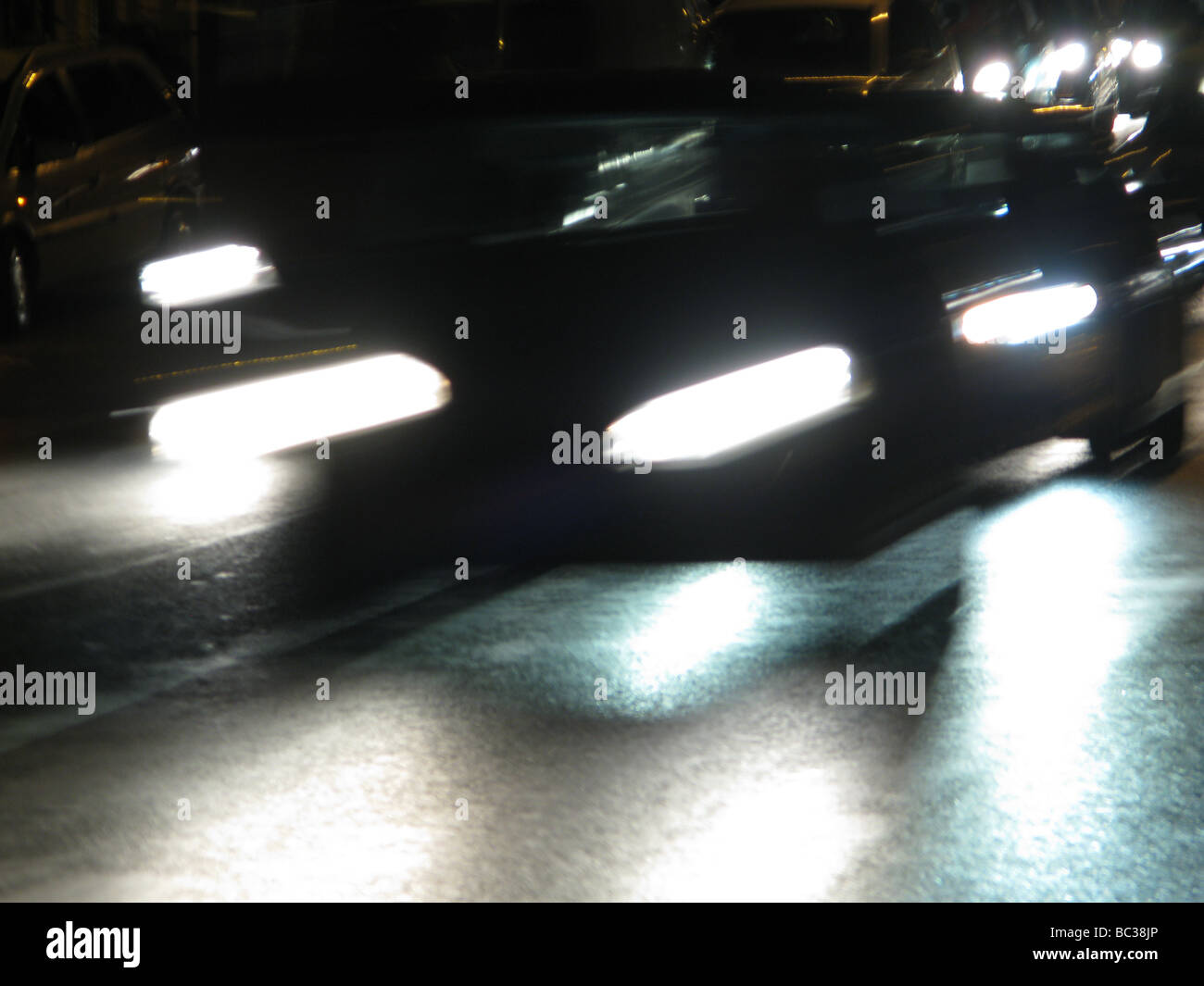 fast cars in dark street at night Stock Photo - Alamy