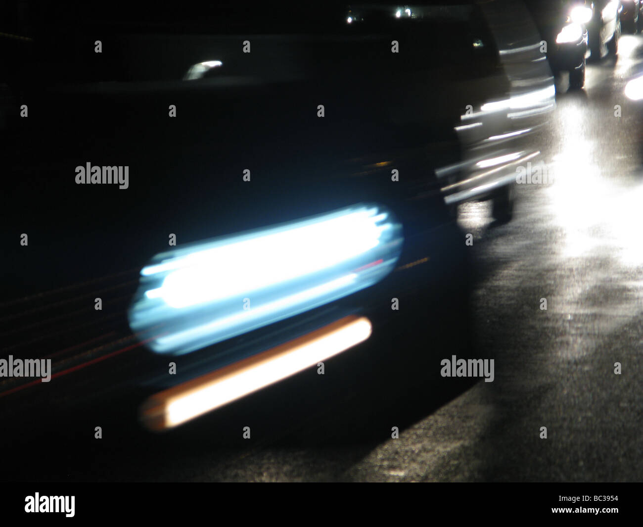 fast cars in dark street at night Stock Photo - Alamy