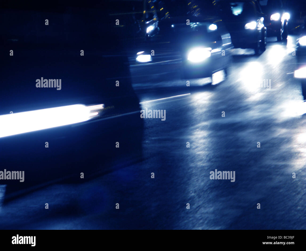 fast cars in dark street at night Stock Photo - Alamy