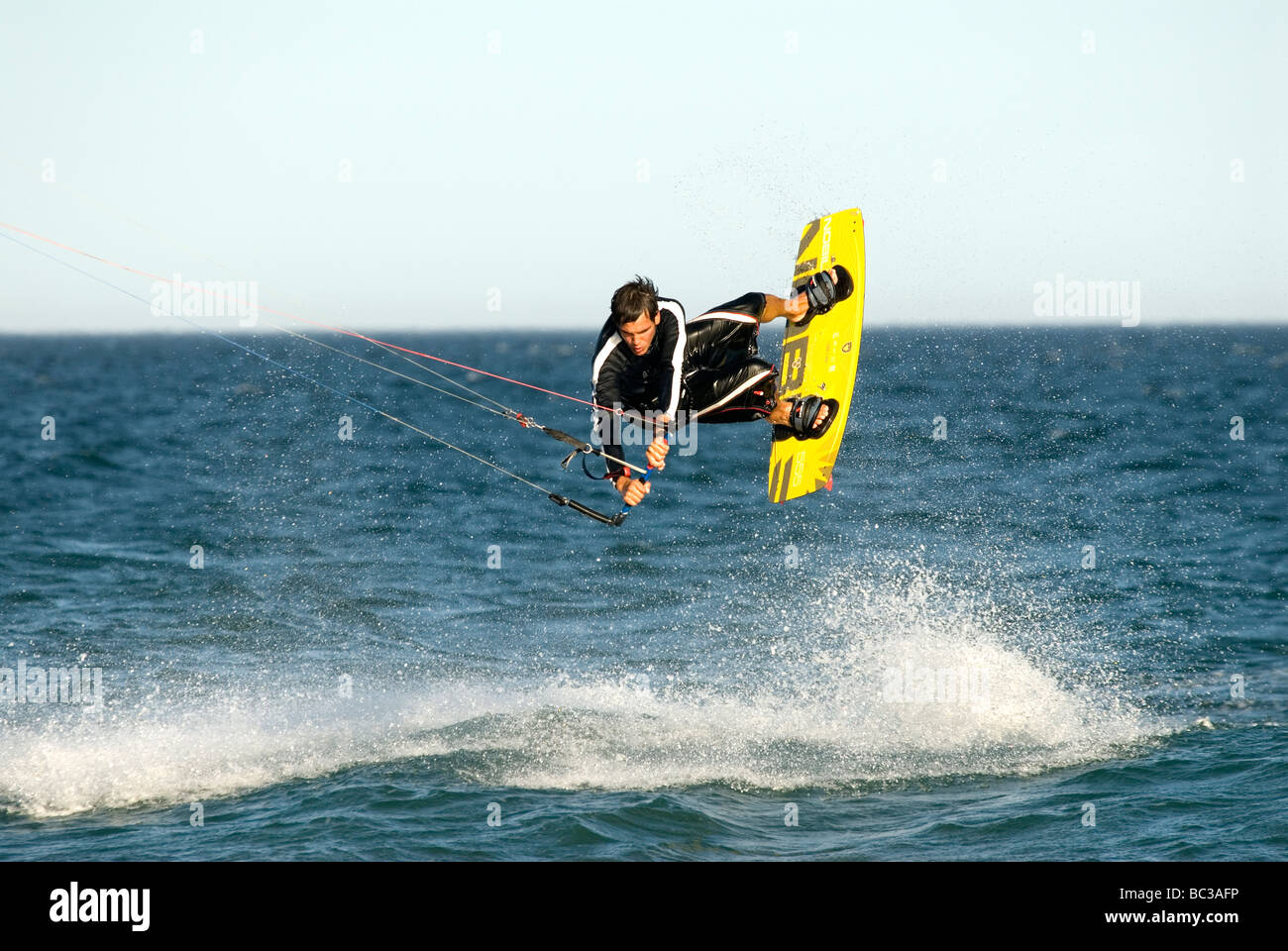 Kite surfer catching air Stock Photo - Alamy