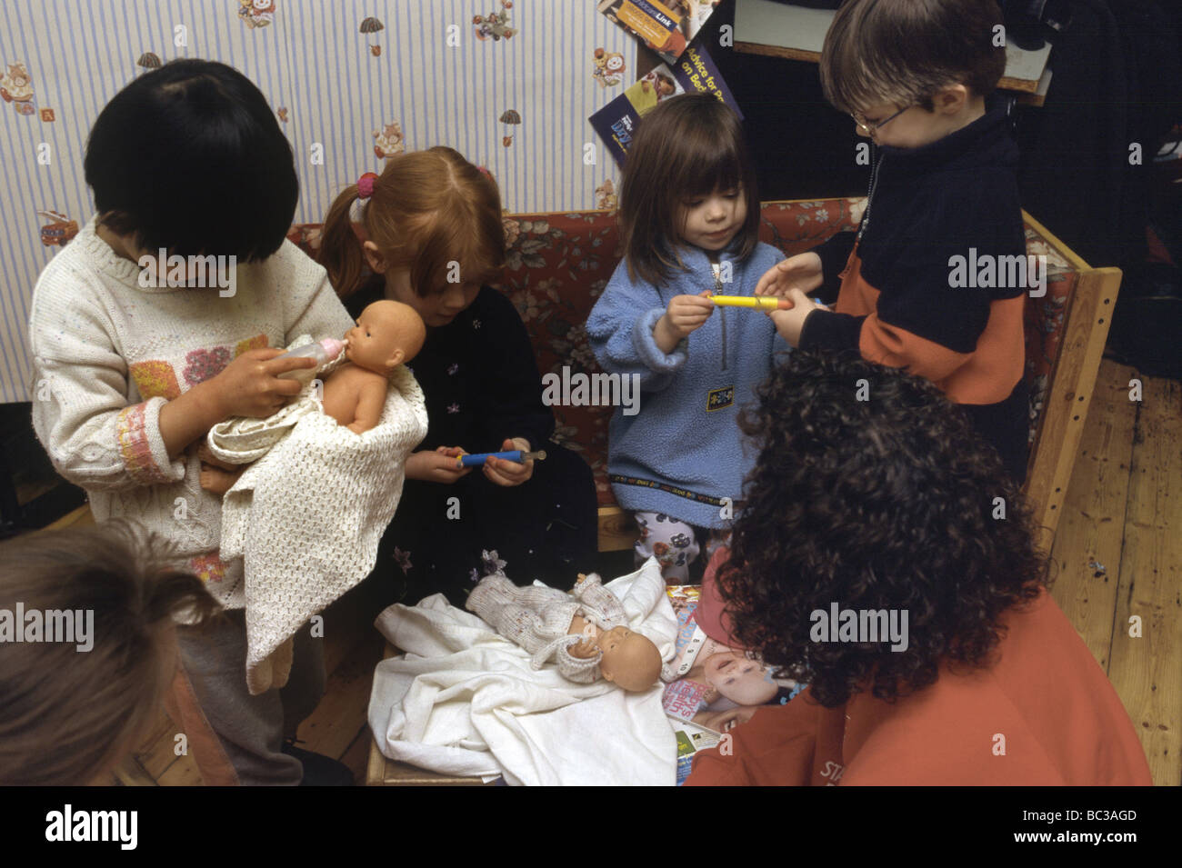 Nursery school children role playing hi-res stock photography and ...