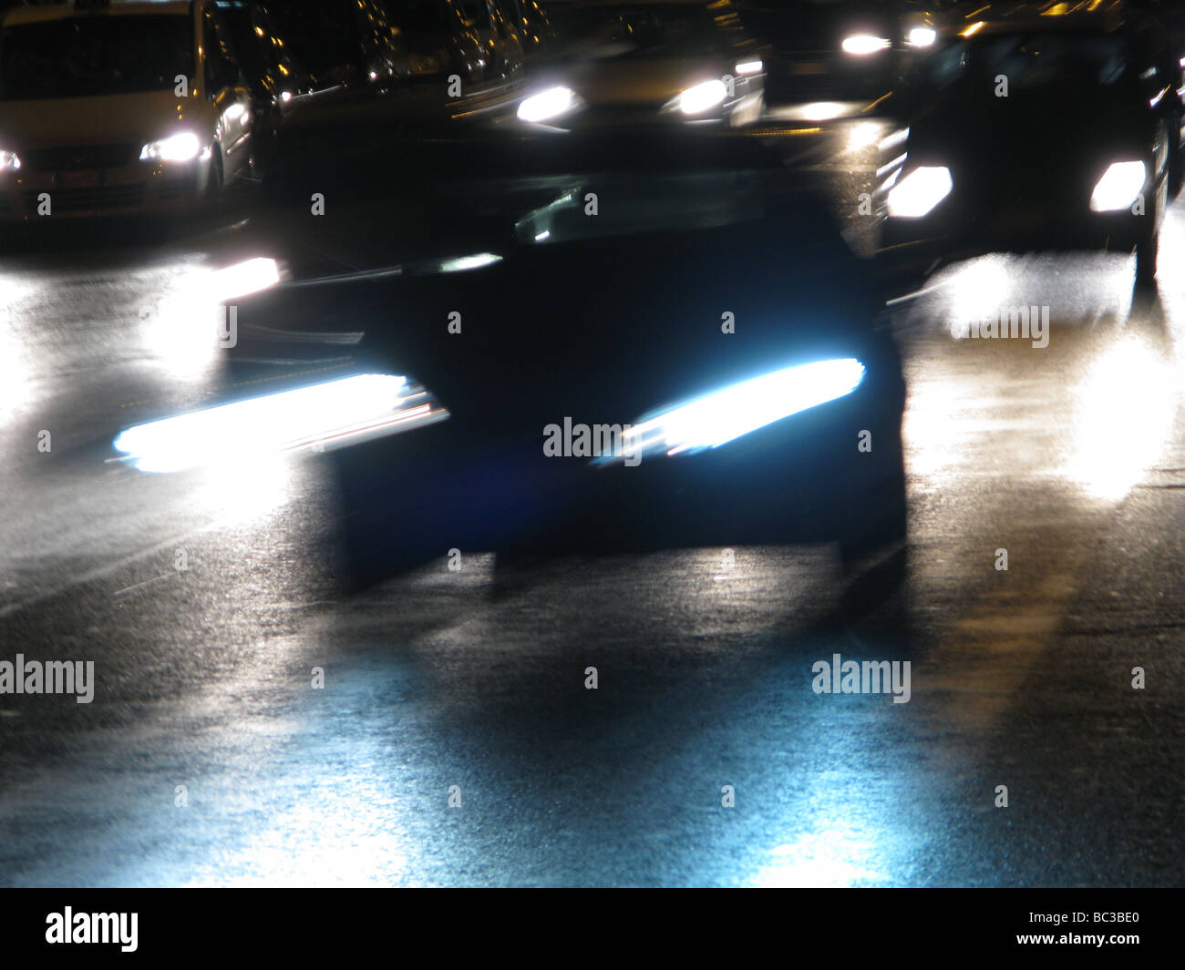 fast cars in dark street at night Stock Photo - Alamy