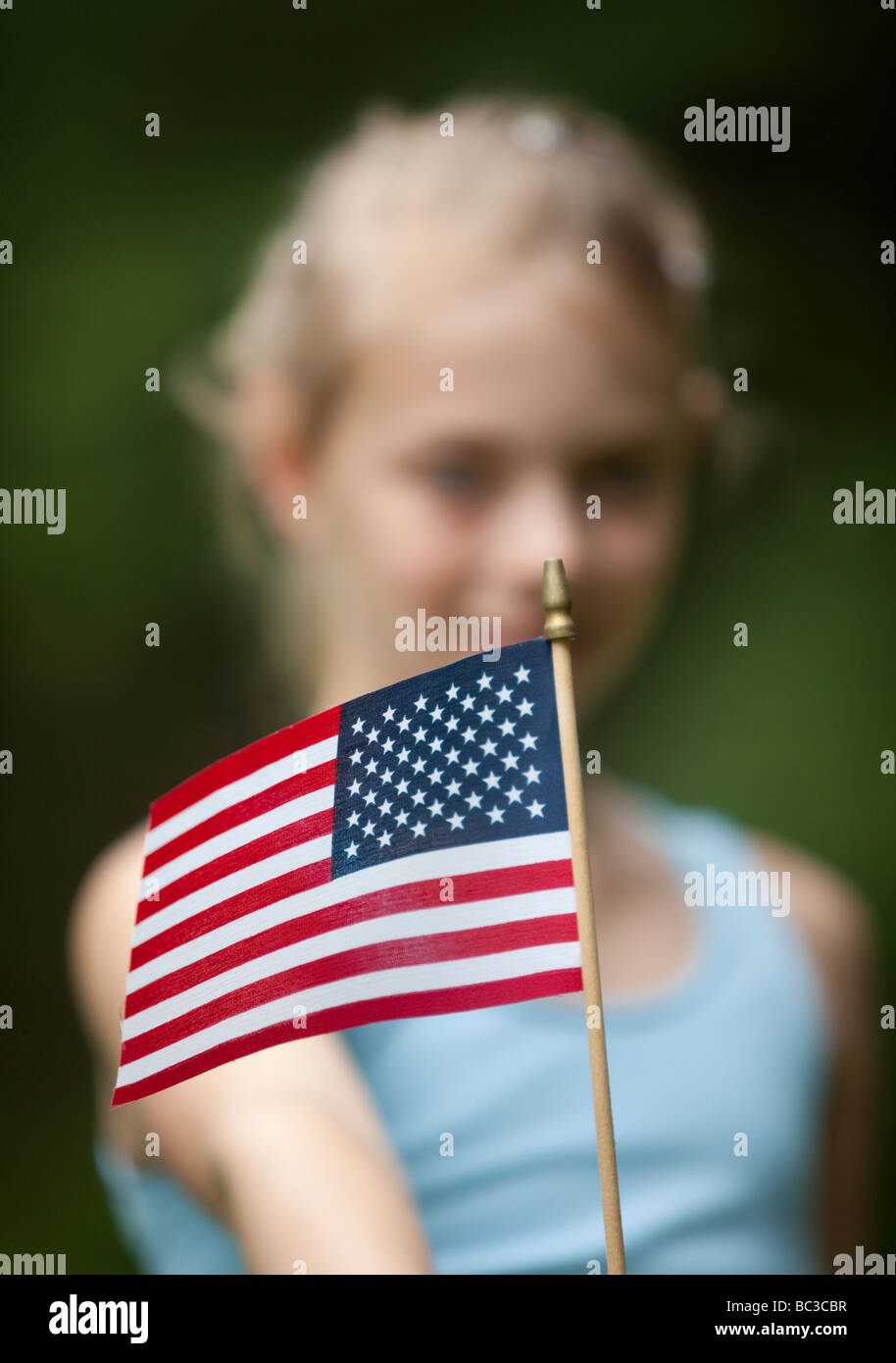Child holding an American flag Stock Photo - Alamy