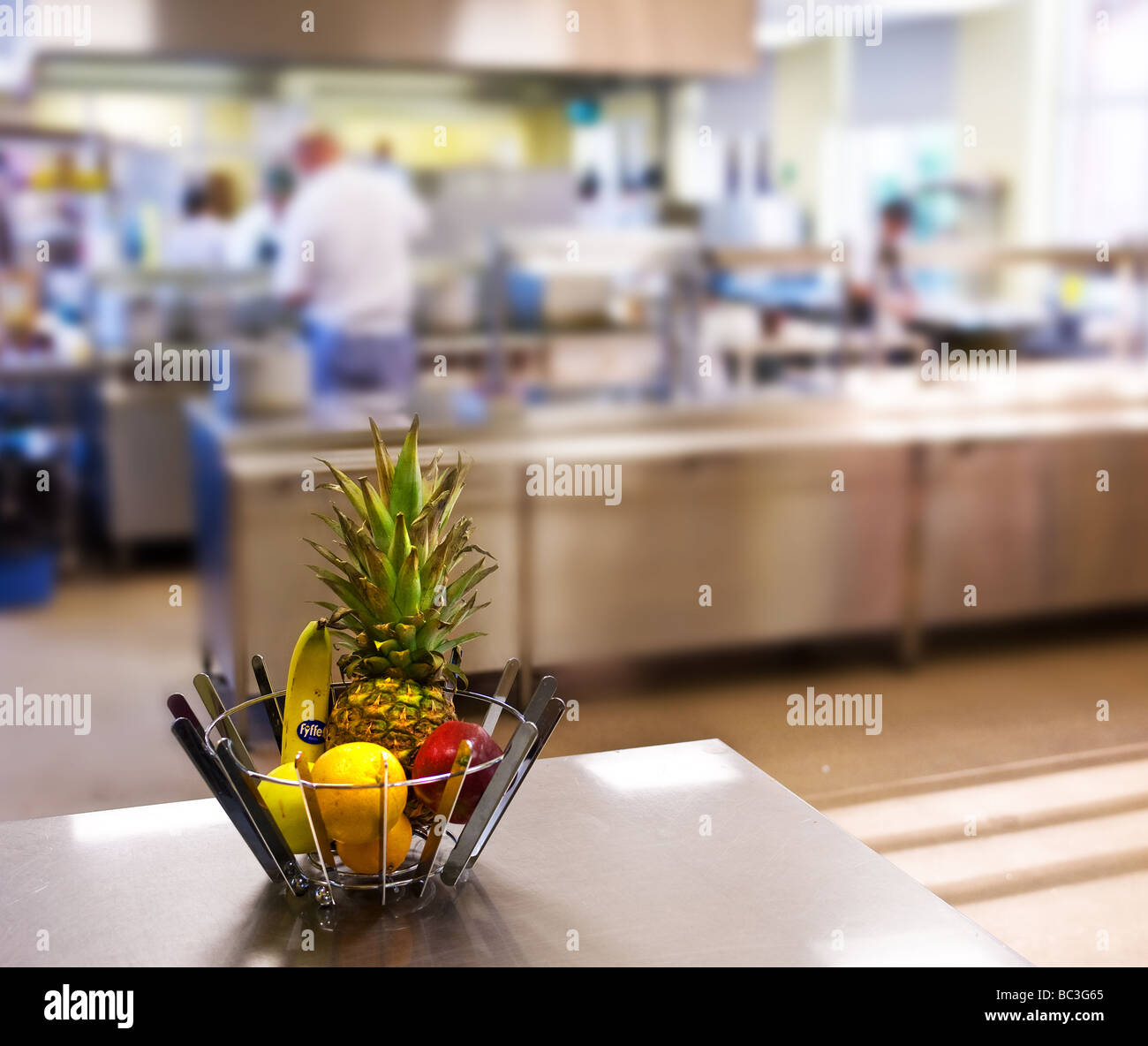 A bowl of fruit in a school kitchen. Photo by Gordon Scammell Stock ...