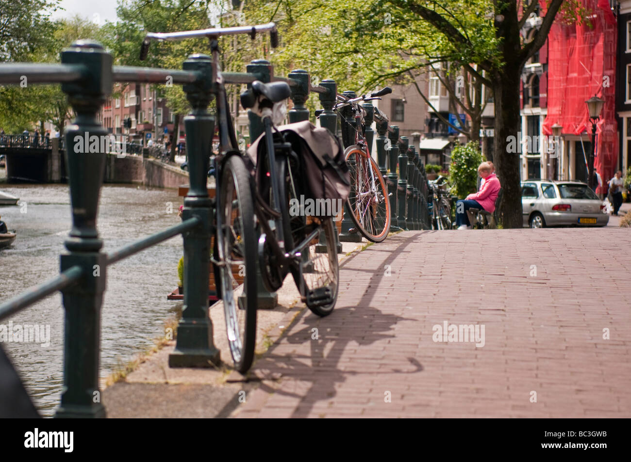 Bicycles chained to railing hi-res stock photography and images - Alamy