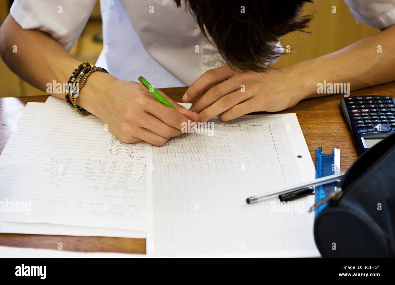 A student working in a classroom. Photo by Gordon Scammell Stock Photo ...