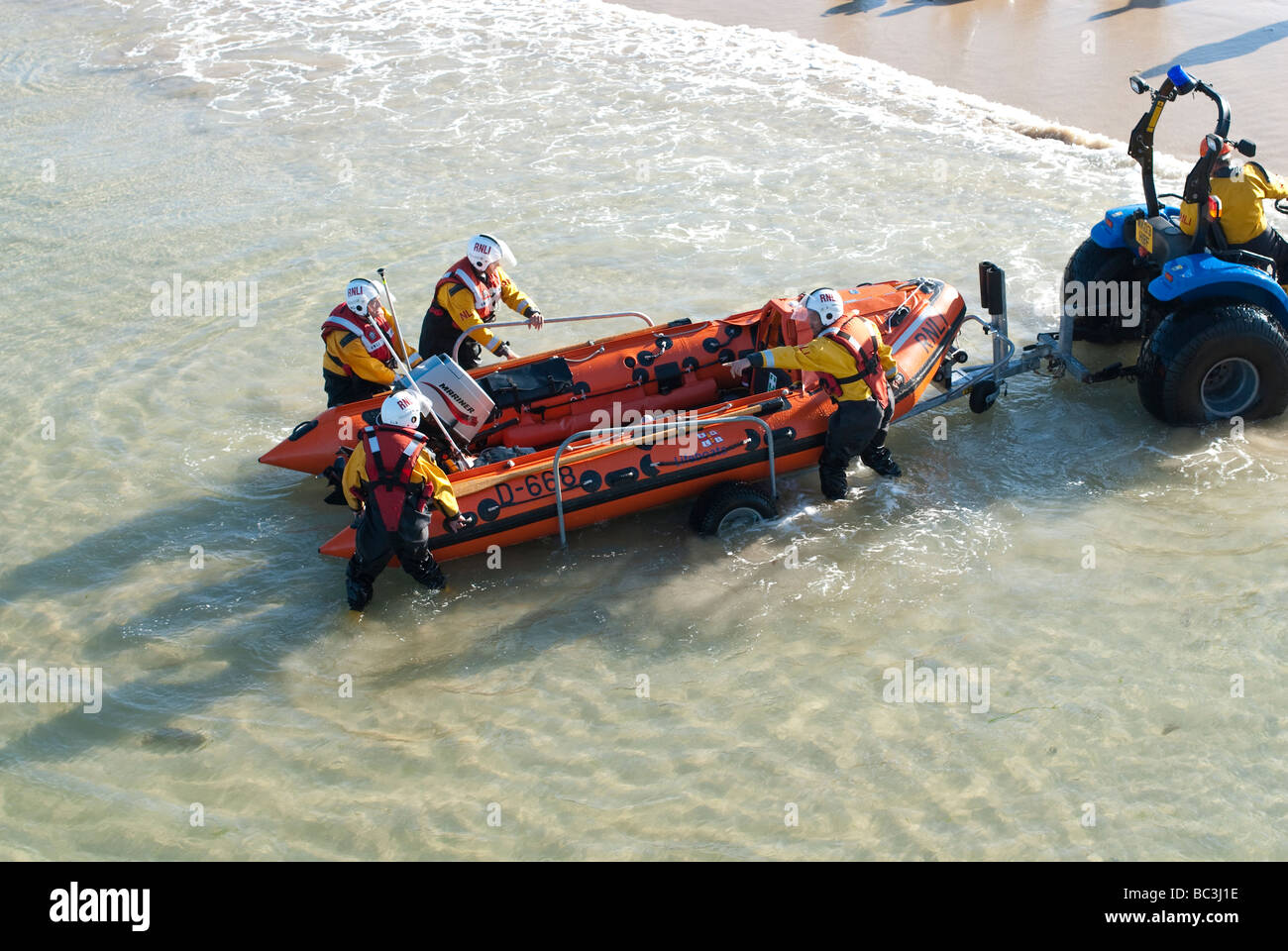 The RNLI launch their inflatable rescue boat at St Ives Stock Photo - Alamy