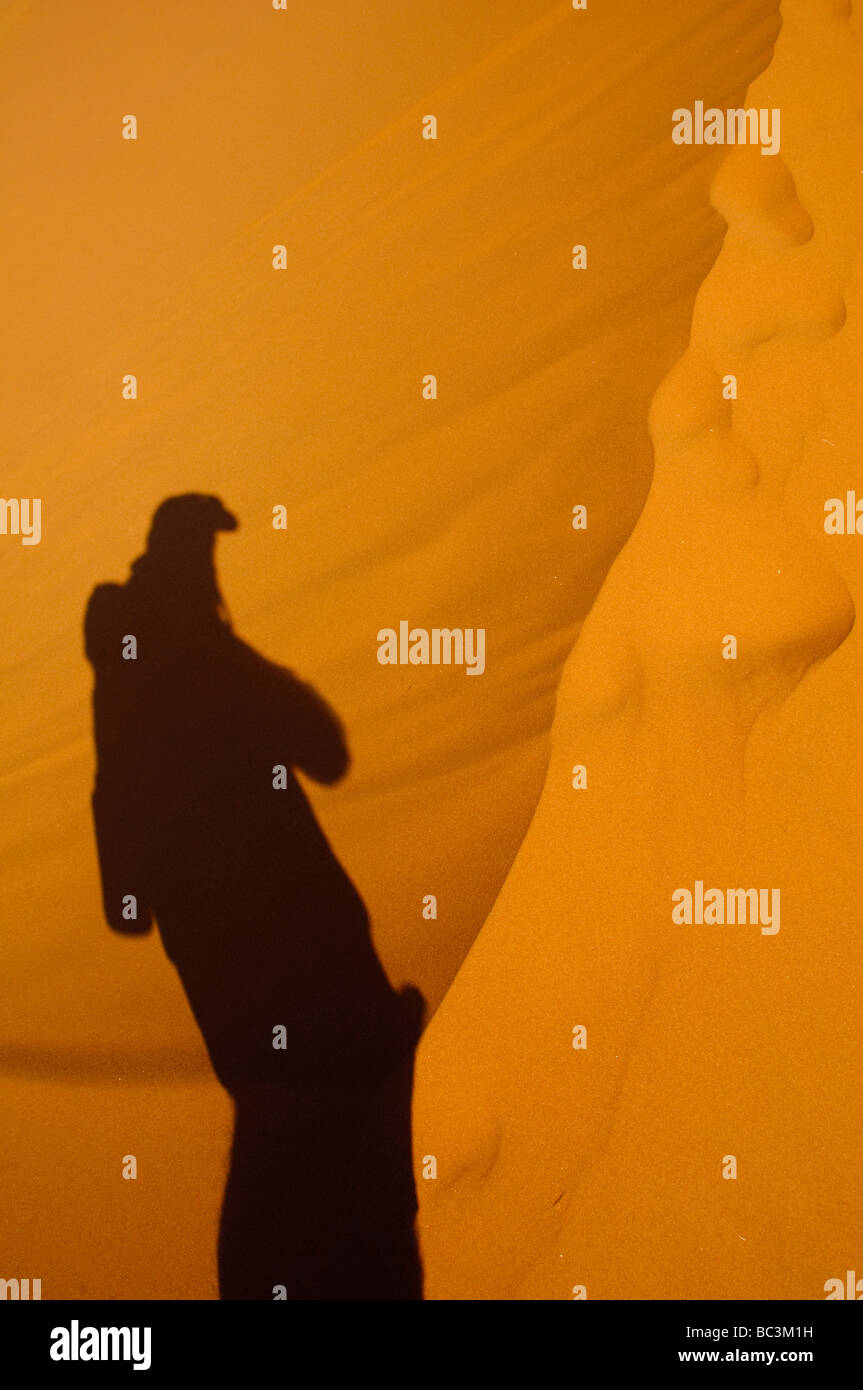 photographer's shadow on the beautiful sand dune landscape of ...