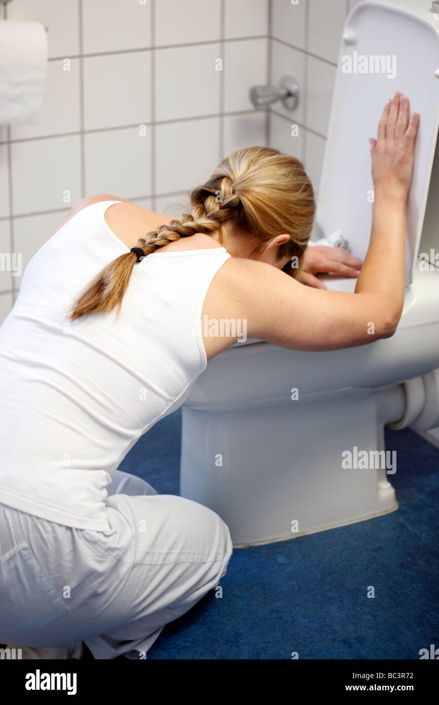 Woman is vomiting sickness Stock Photo - Alamy