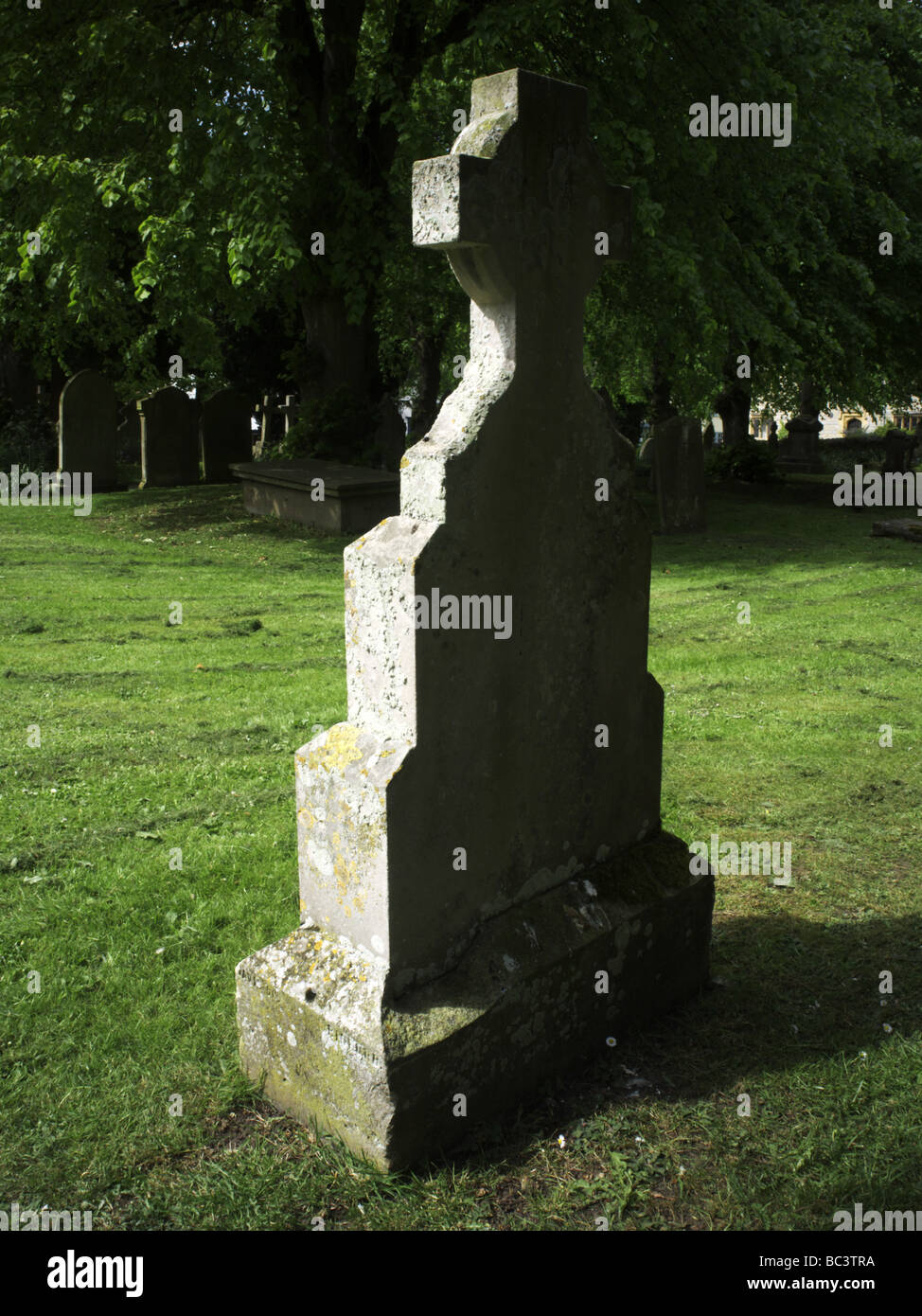 gravestones lit by the sun in a country cemetery Stock Photo - Alamy