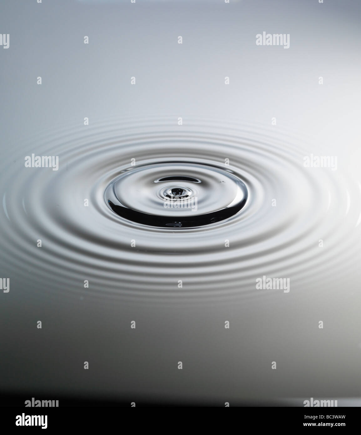 water drop in water reflecting silver Stock Photo - Alamy