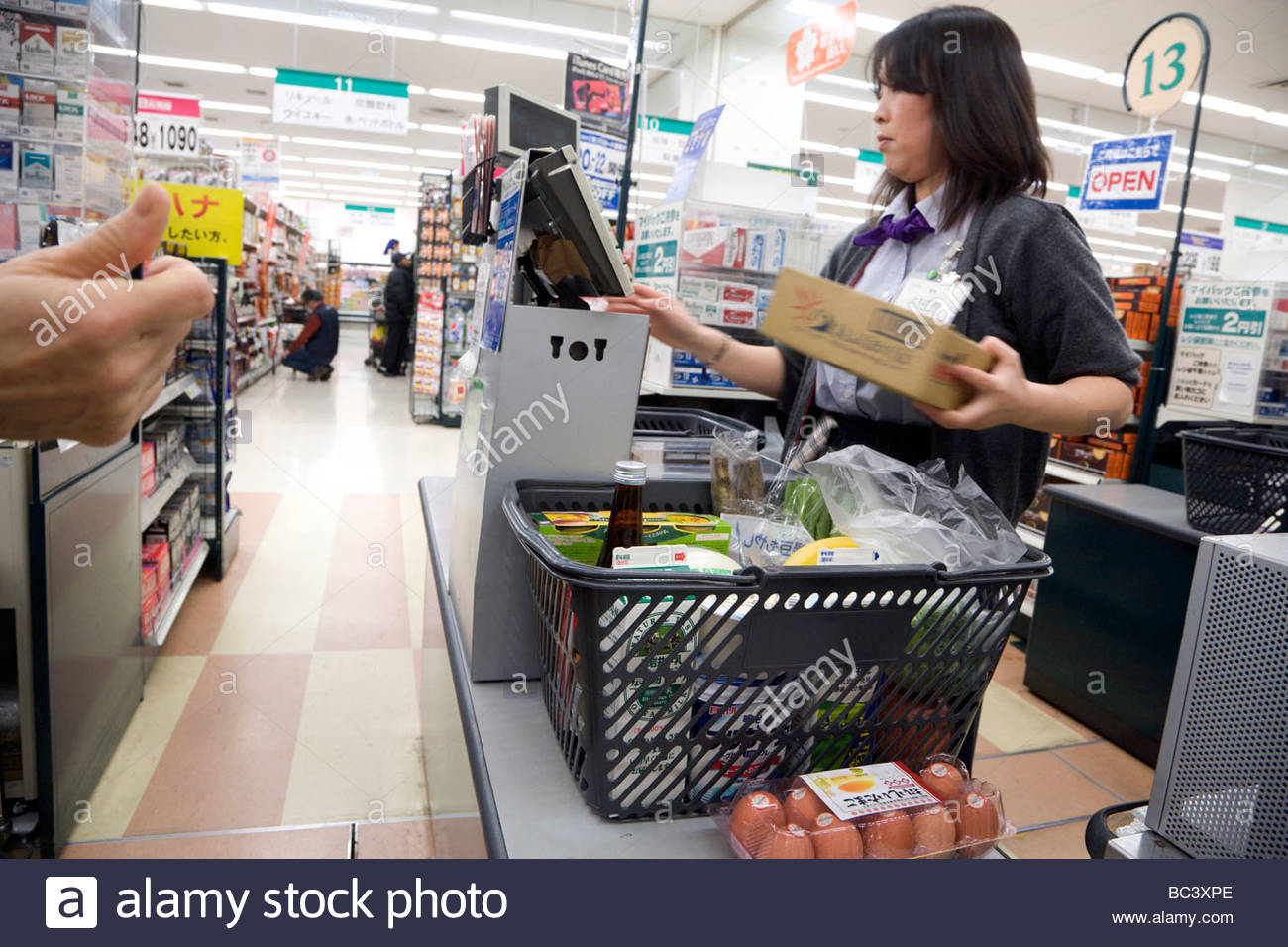 cashier at a large supermarket in Japan Stock Photo: 24673110 - Alamy