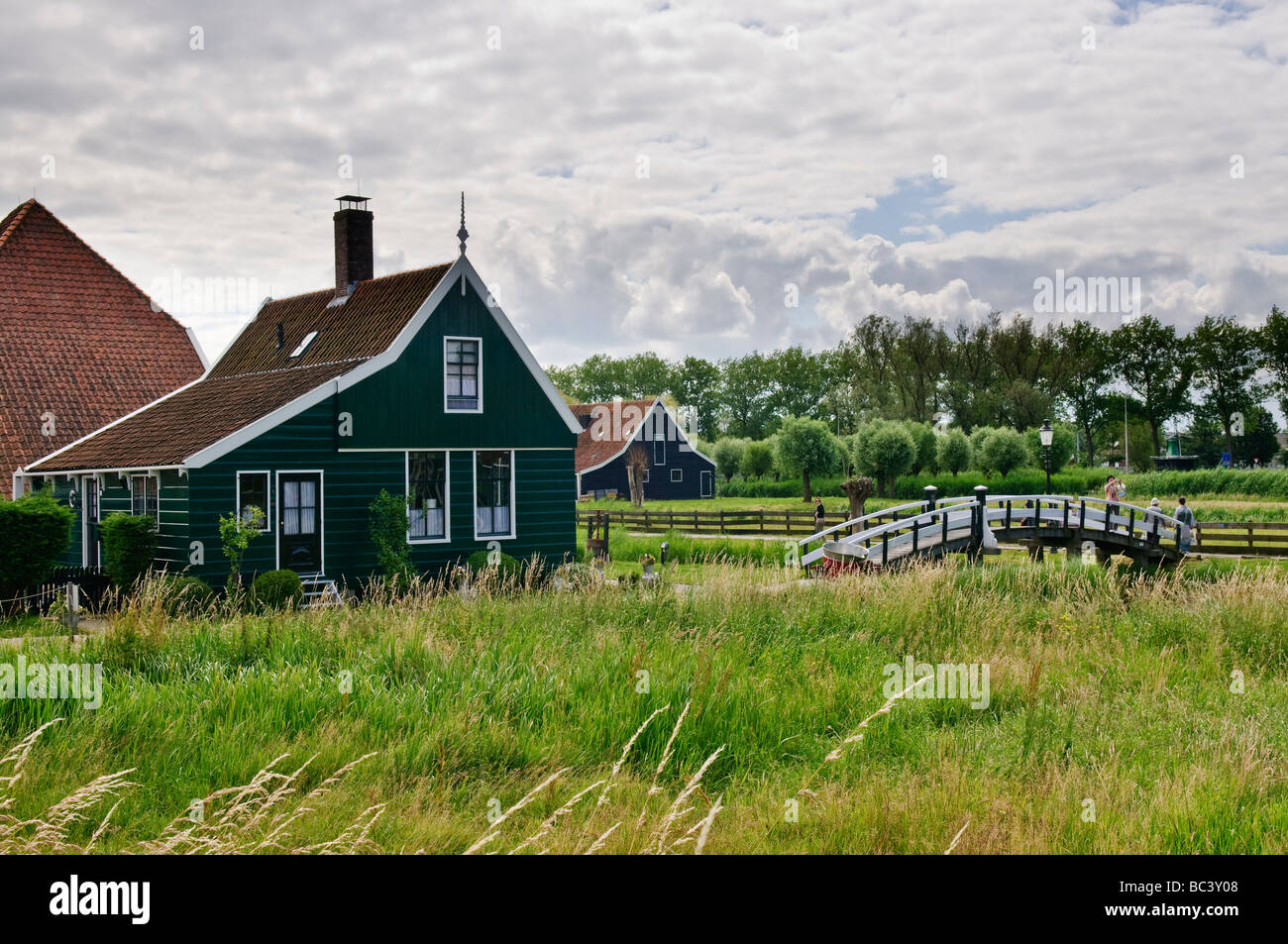 Green timbered house and footbridge at Zaandijk, Netherlands Stock ...