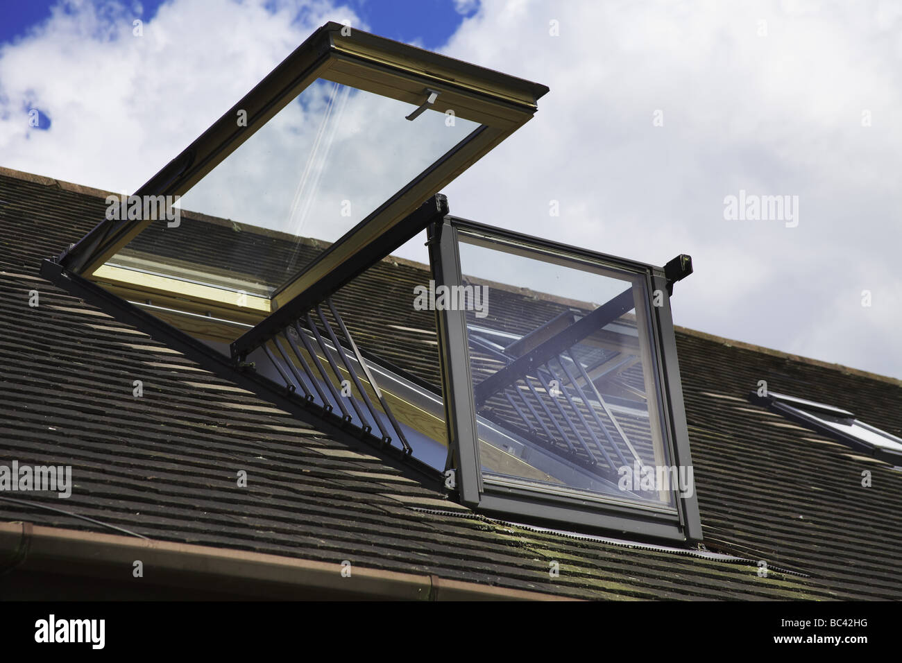 Windows in the roof of a house Stock Photo - Alamy