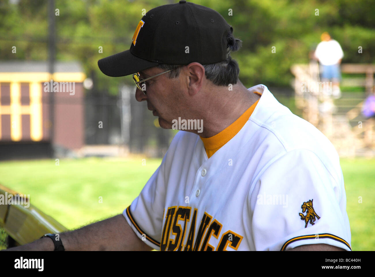coach talking to players at high school baseball game Stock Photo - Alamy
