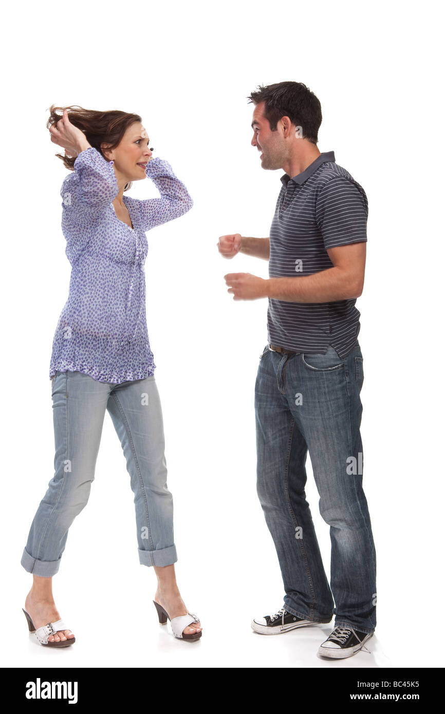 Angry couple yelling at each other over white background Stock Photo ...